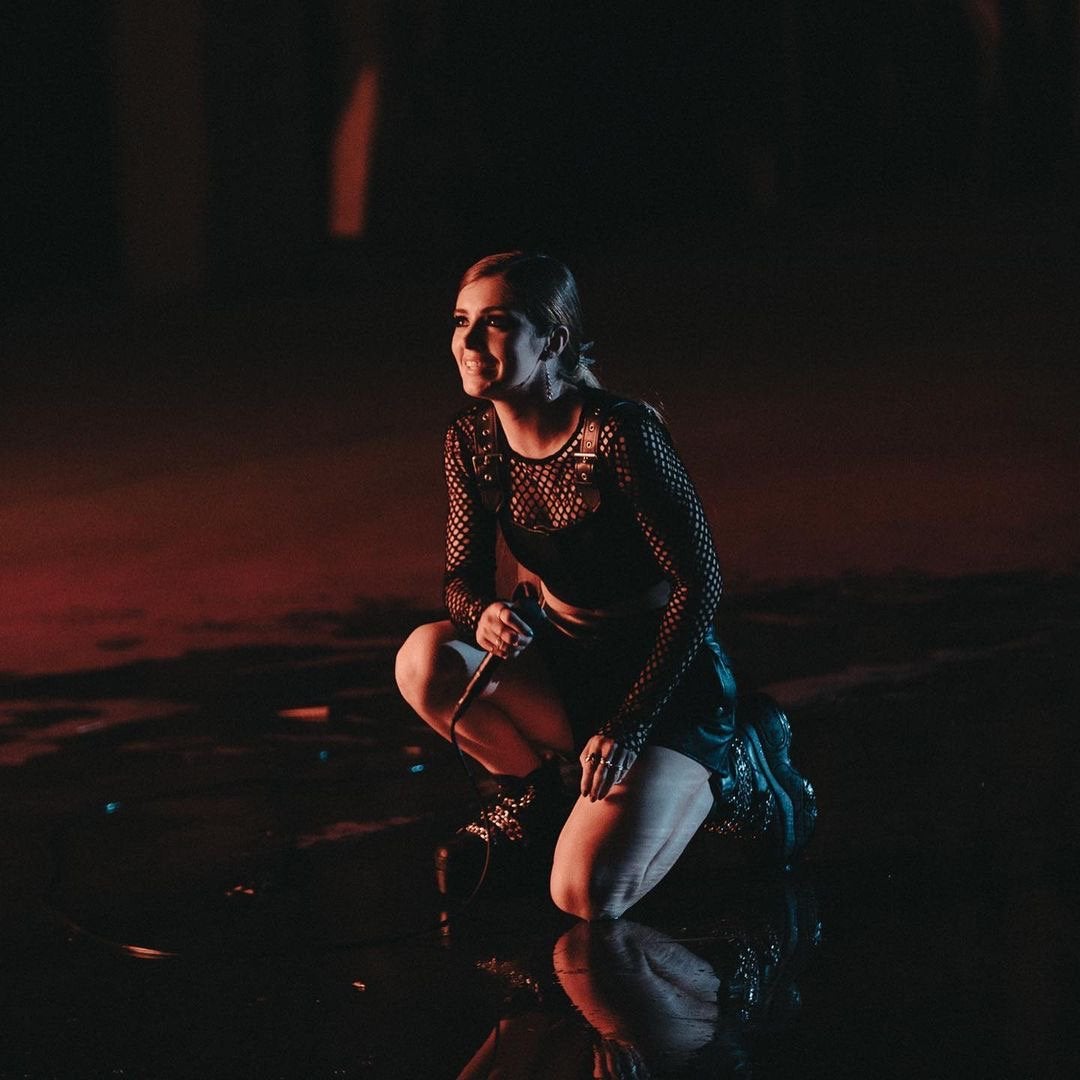 Chrissy Costanza kneeling. | Scrolller