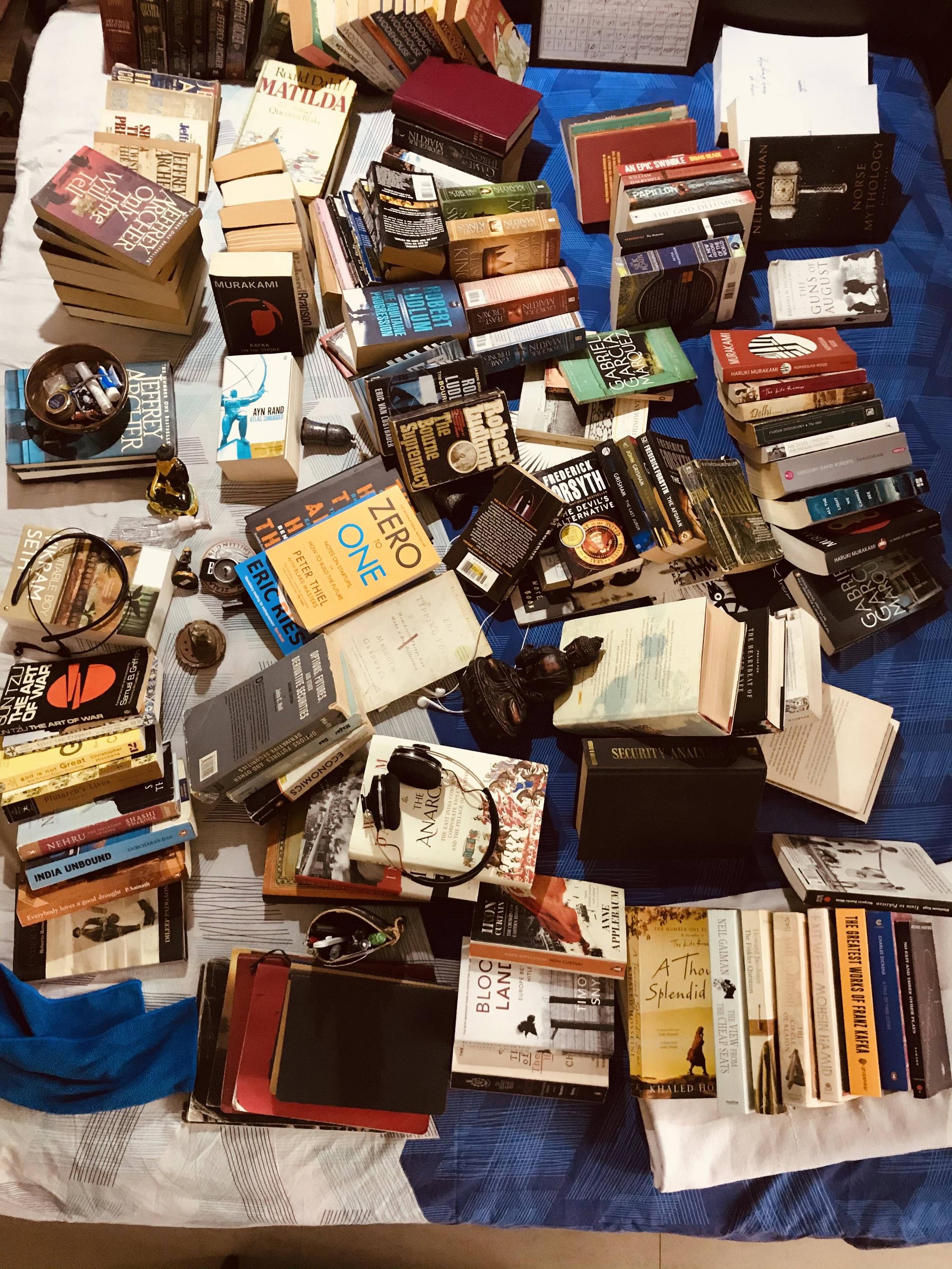 Cleaning day at my place so had to empty my shelves and put my books on the bed | Scrolller