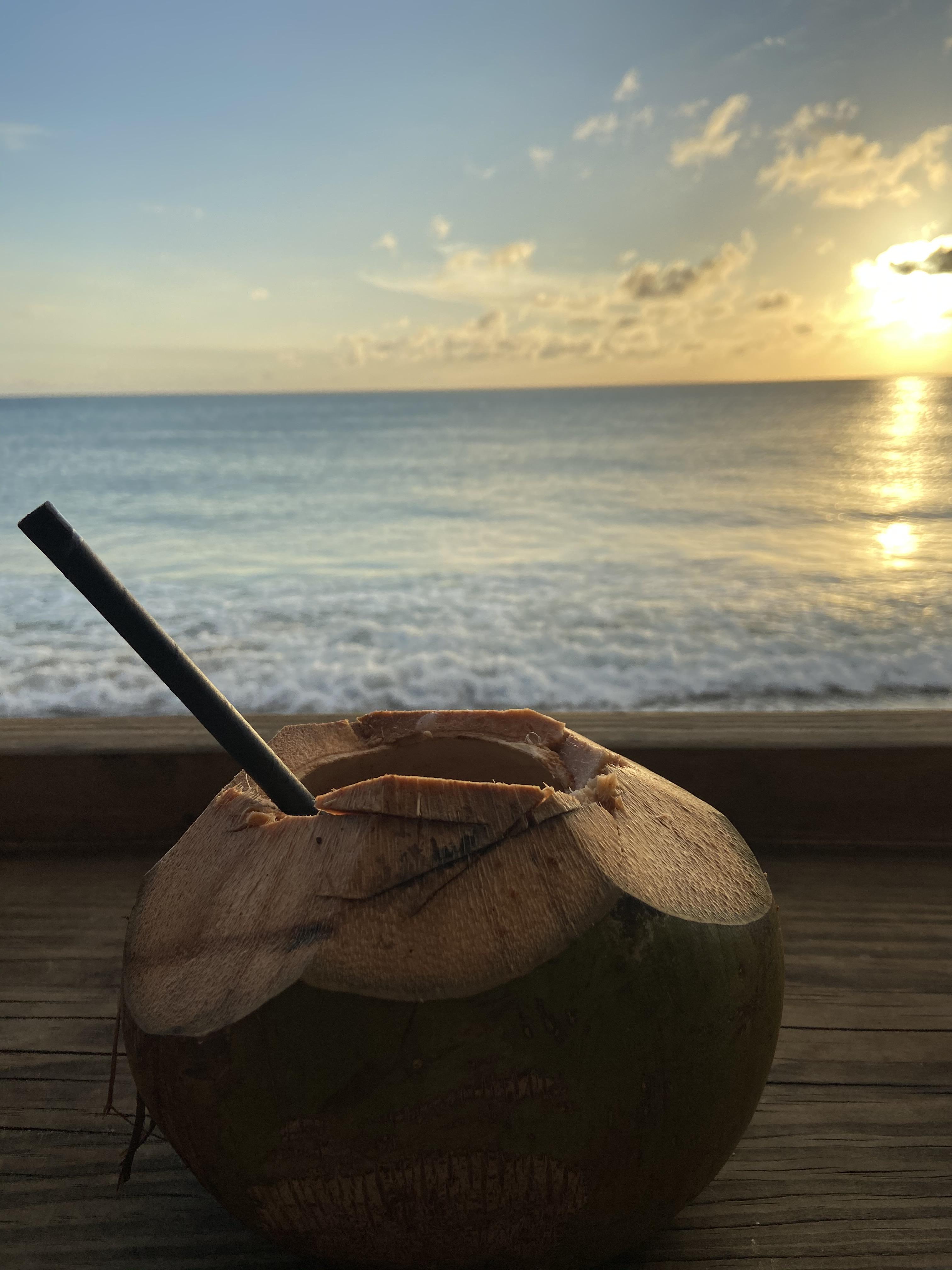 Coconut rum drink at the beach | Scrolller