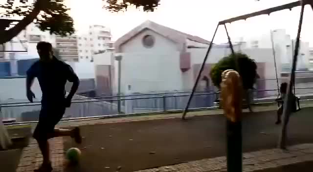 Dad teaching his son to be a goalkeeper. | Scrolller