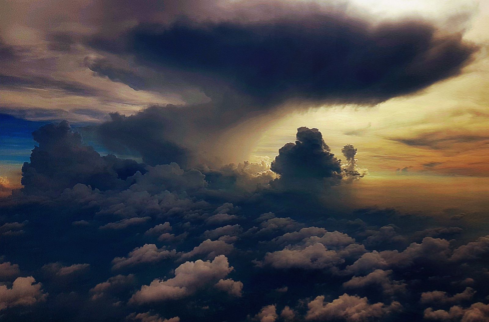 Dark brooding clouds somewhere over the South China Sea at 30,000 Ft. [OC] [1600x1056] | Scrolller