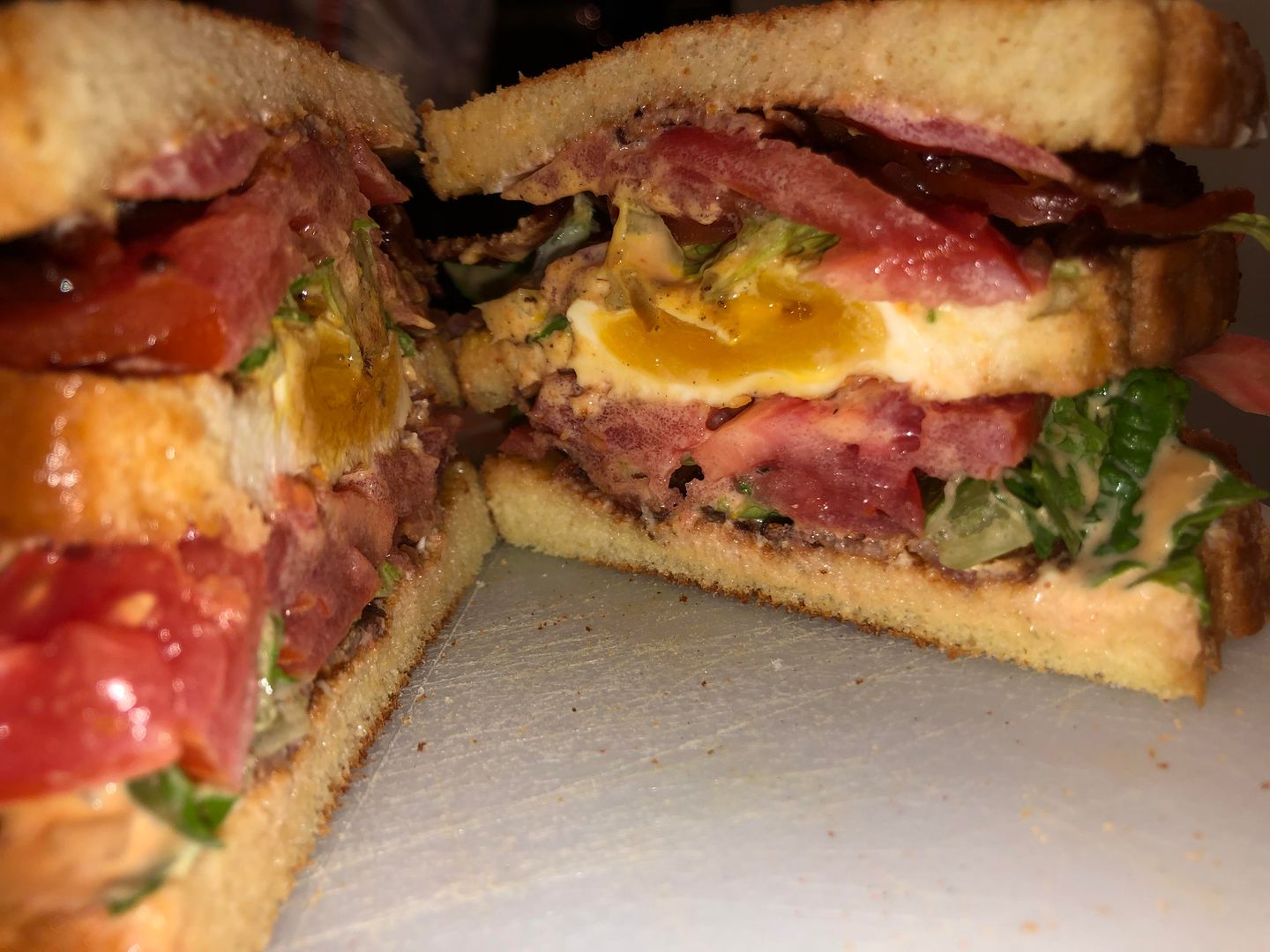 Double decker BLT with a fried egg in the middle bread | Scrolller