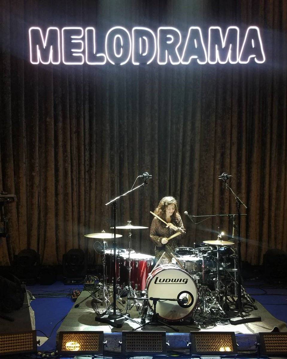 Ella on the drums. | Scrolller