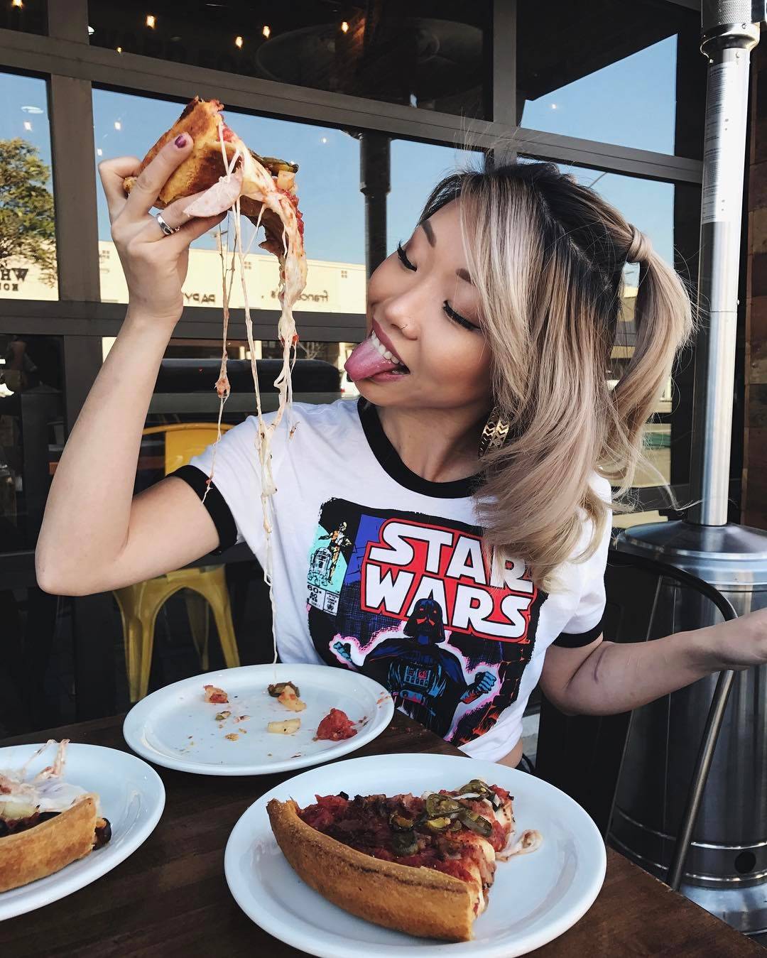 Enjoying pizza | Scrolller