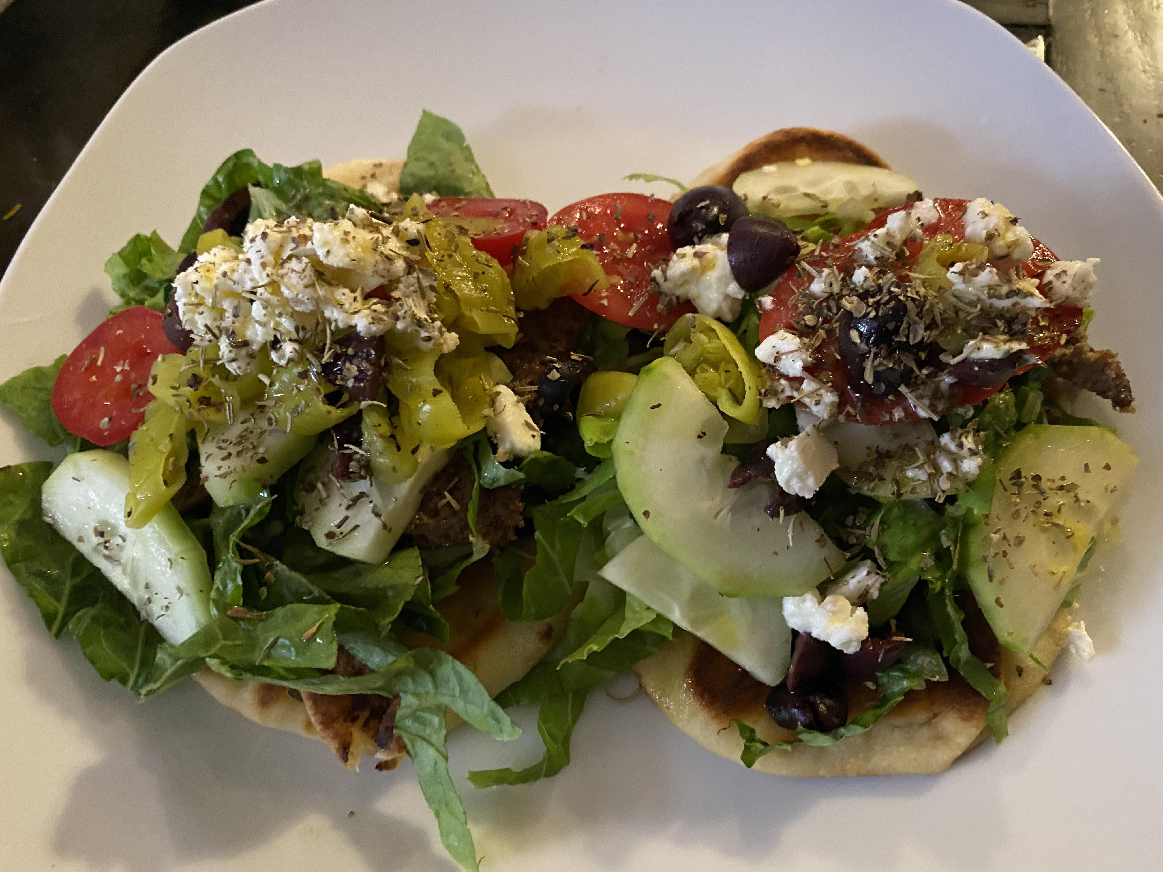 Fully loaded gyro salad on toasted naan | Scrolller
