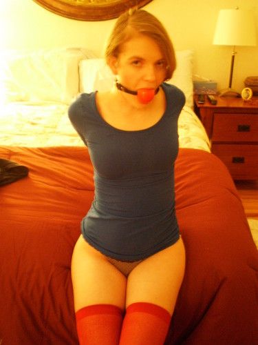 Gagged on the bed | Scrolller