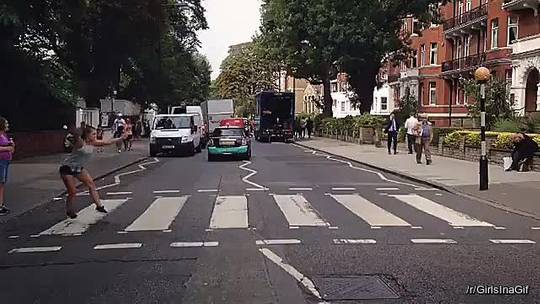 Girl crosses Abbey Road a bit differently from the Beatles. | Scrolller