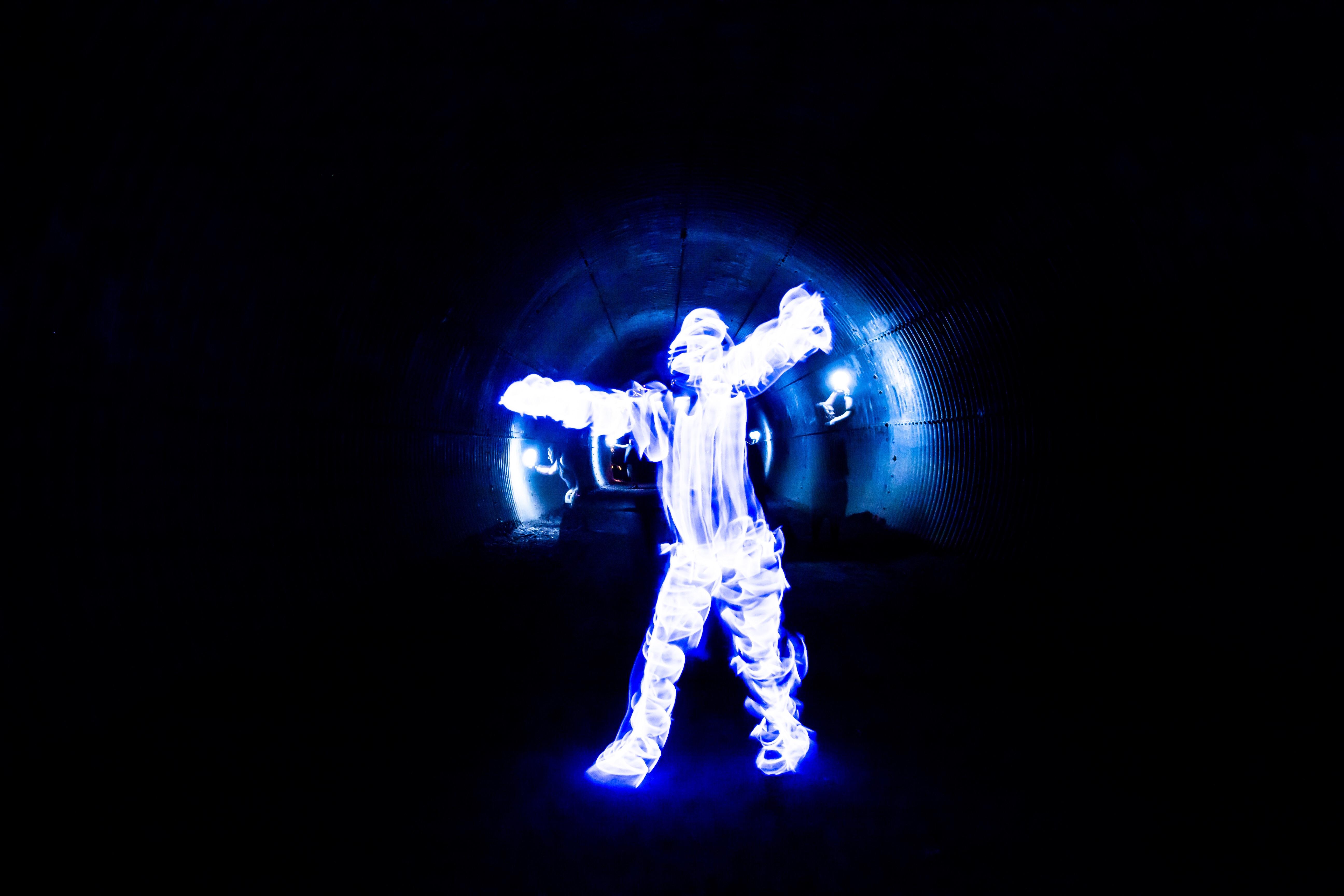 Glow sticks, in a tunnel. | Scrolller