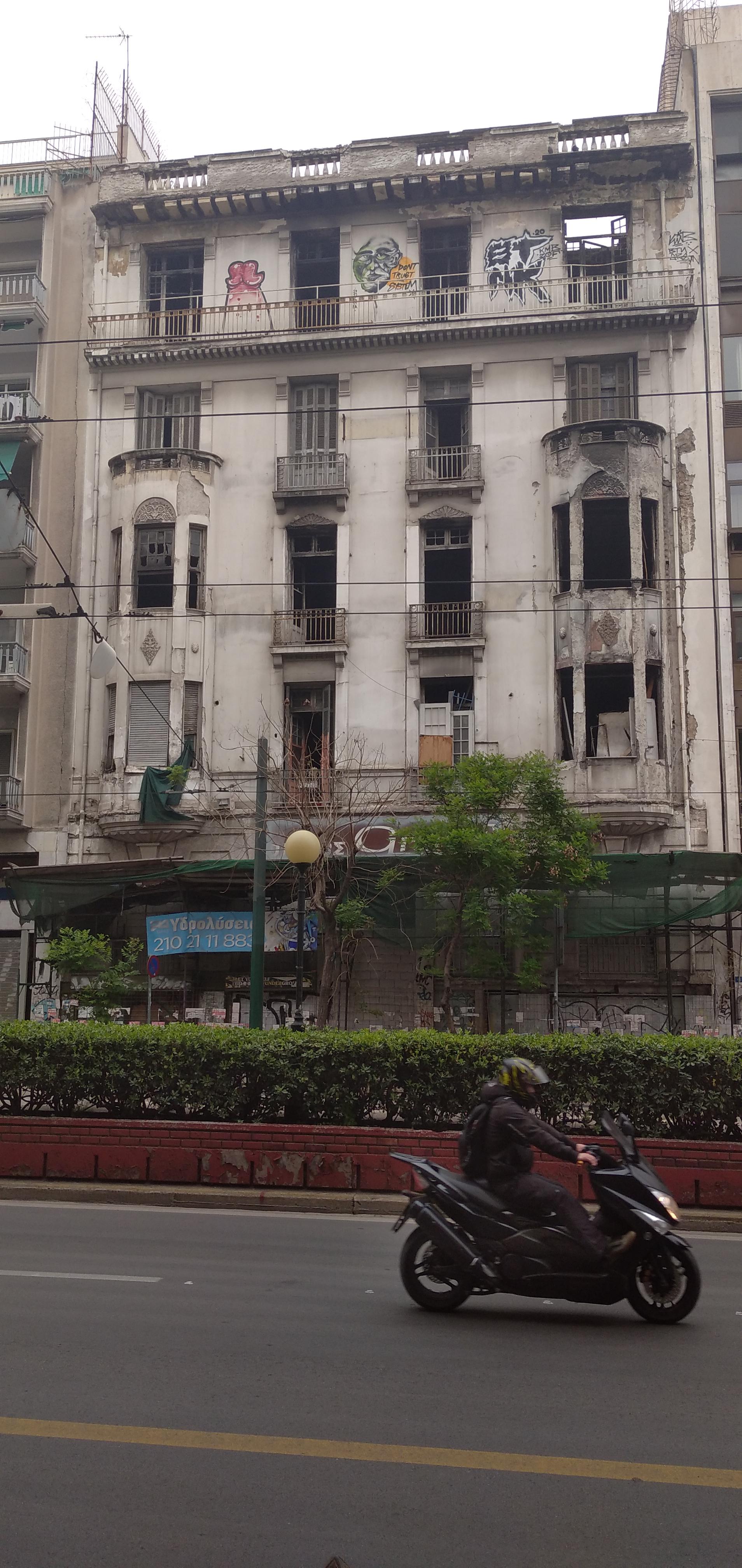 Grey abandoned building in Athens | Scrolller