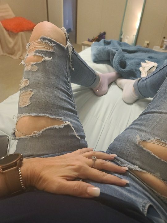 Hand and ripped jeans | Scrolller