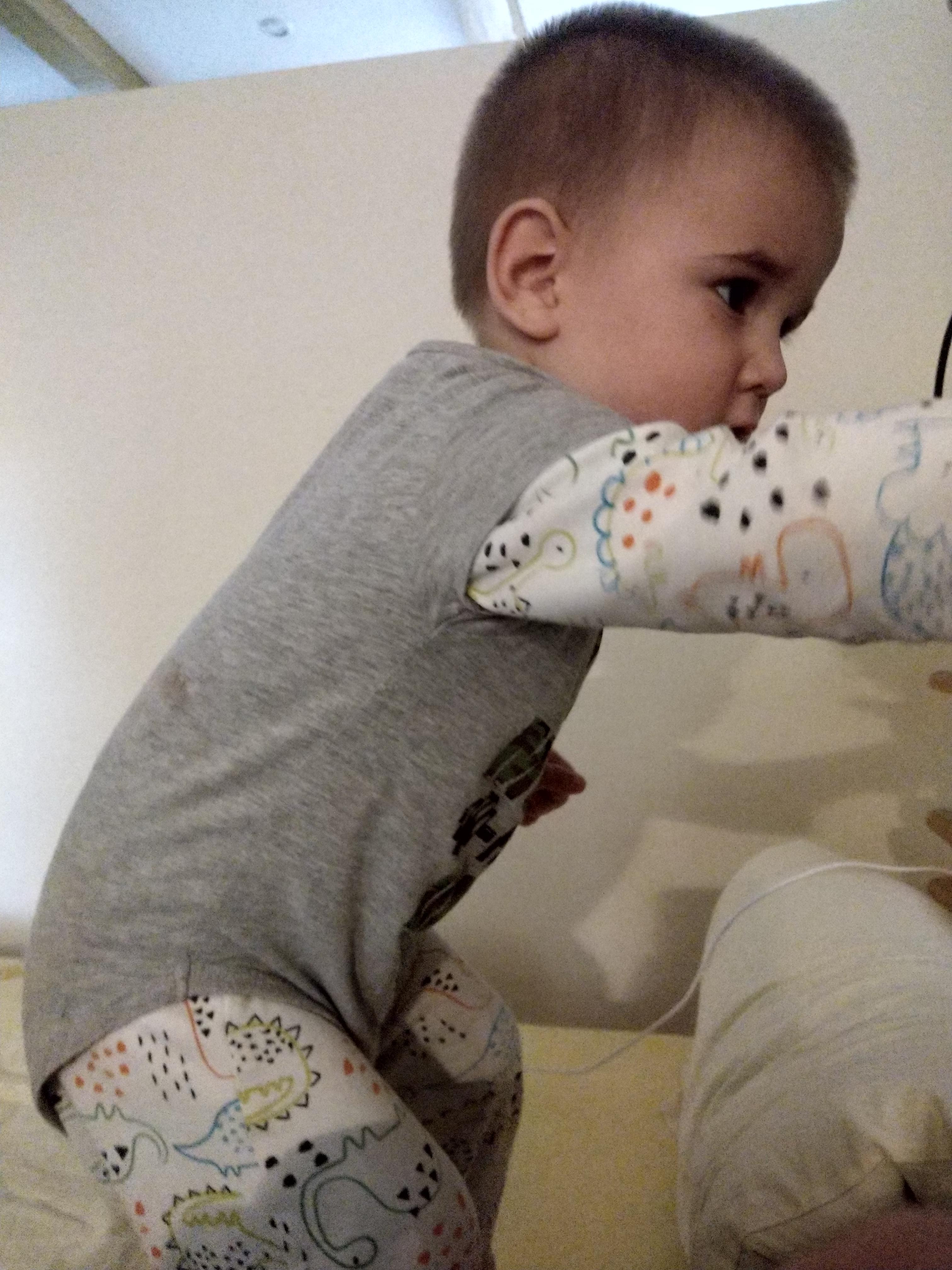 I have solved the issue of my son strippong out of his sleepsuit then nappy.... Vest over the ...