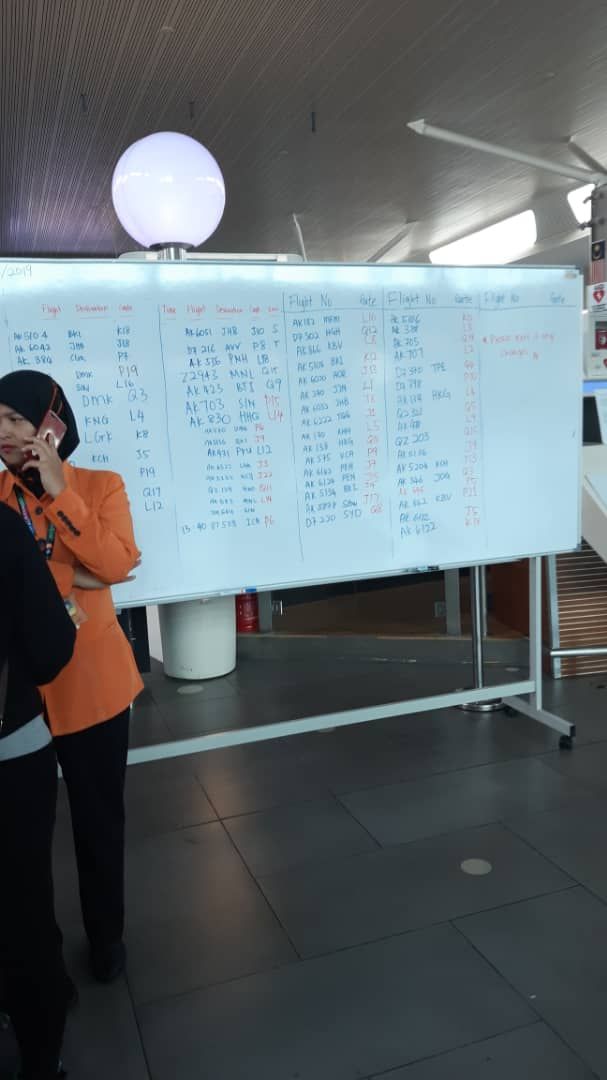 KLIA has resorted to posting up flight schedules on a whiteboard. | Scrolller