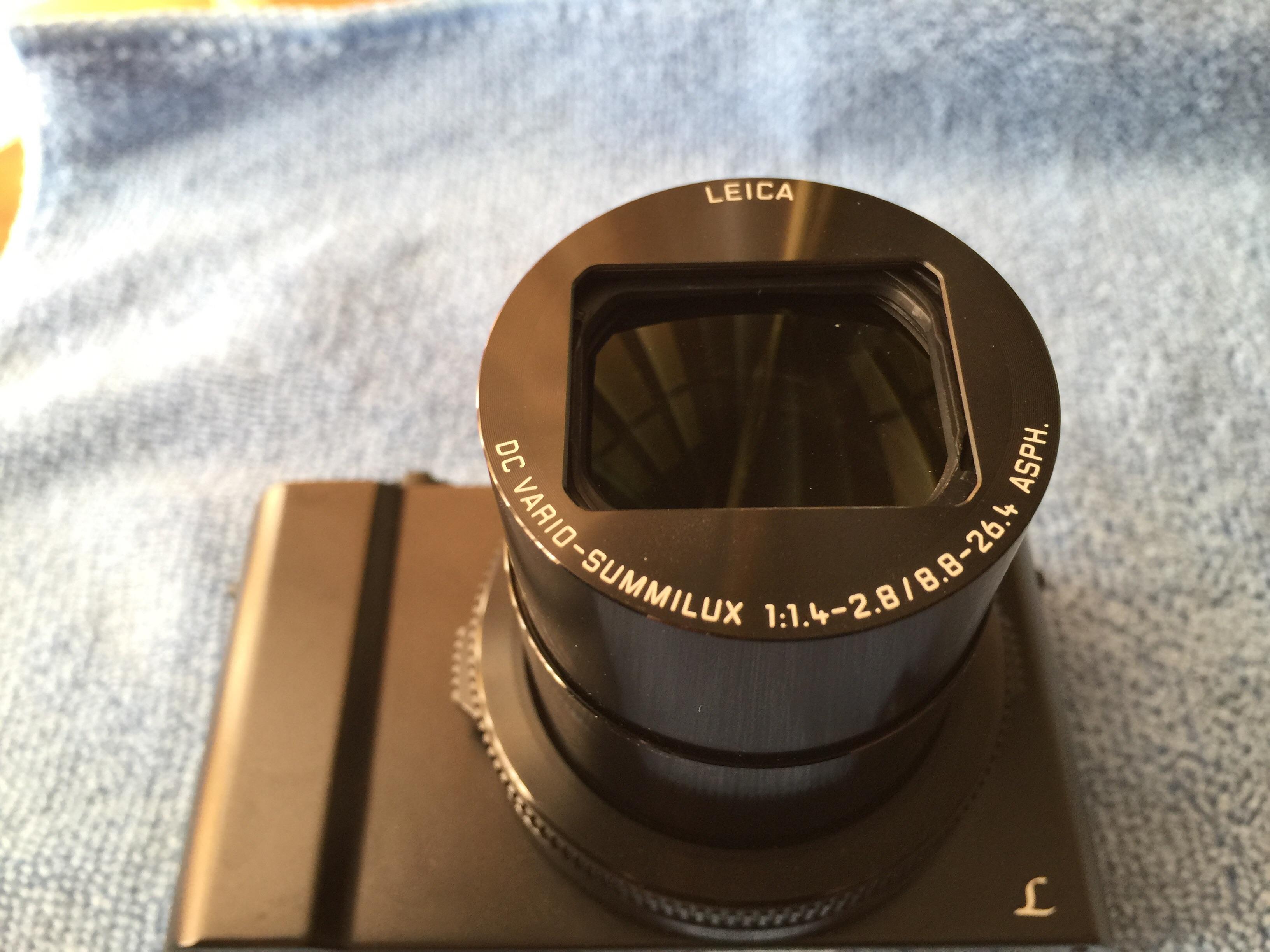 LUMIX LX10 - Dust stuck under the lens | Scrolller