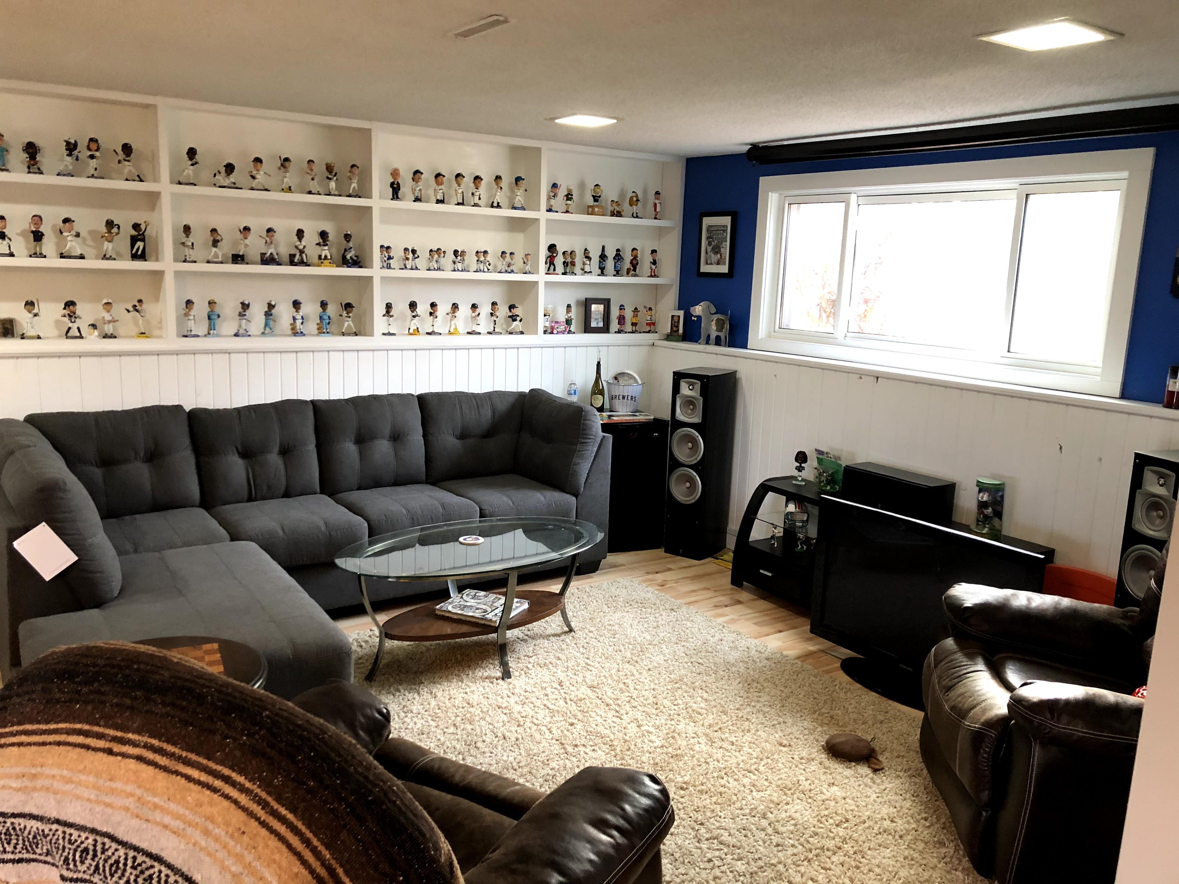 Man cave almost complete, 100" projector screen comes down in front of window. More pics in ...