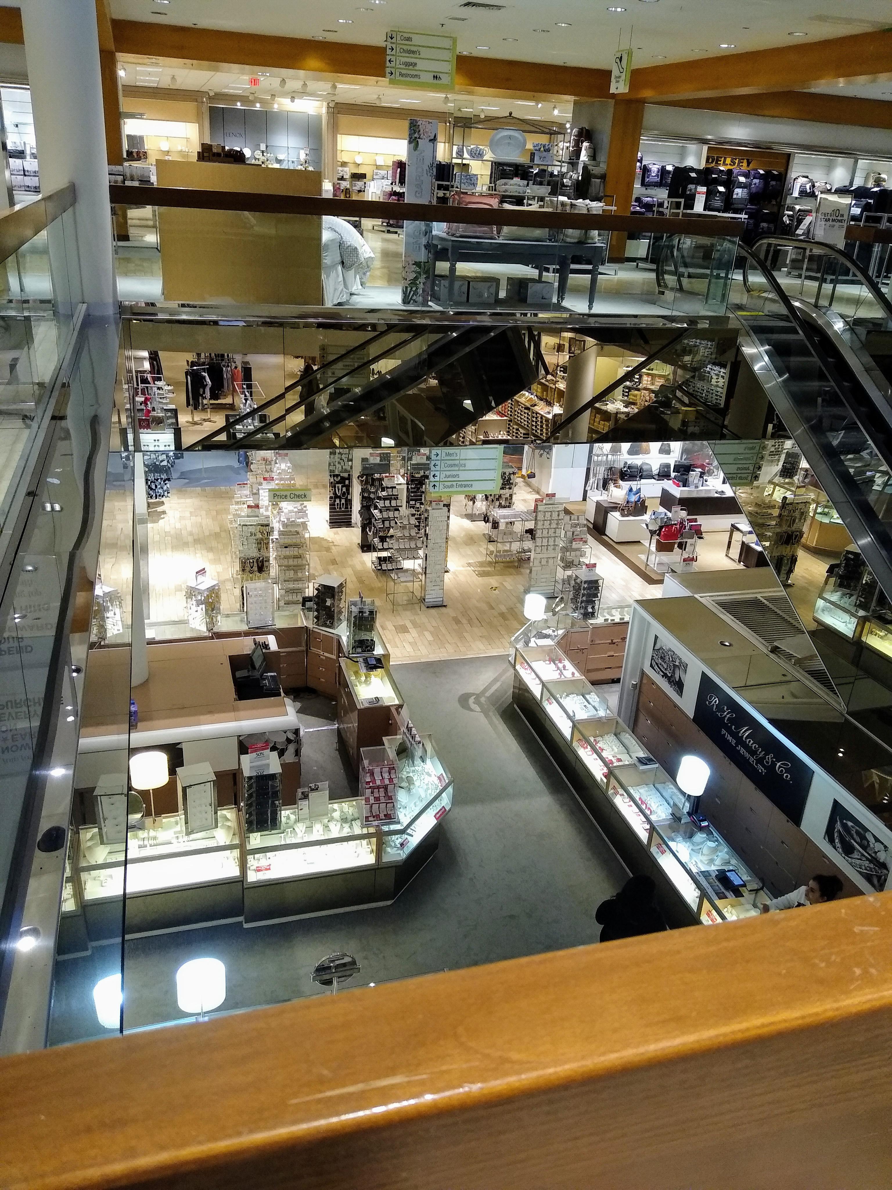 Mirrored glass design around the escalators at a Macy's, originally built in 1983 as a ...