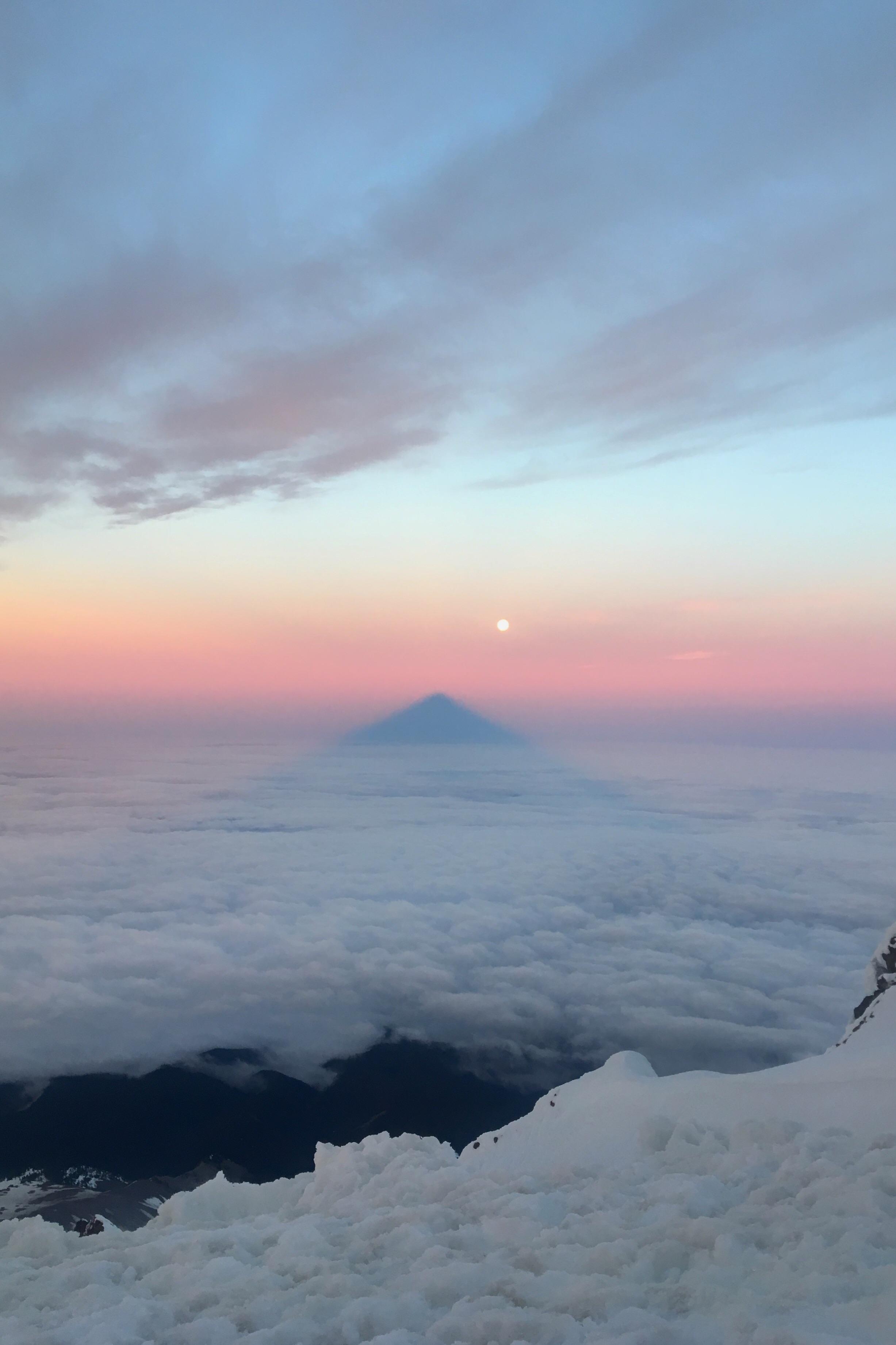 Mt. Hood’s shadow this morning from the summit | Scrolller