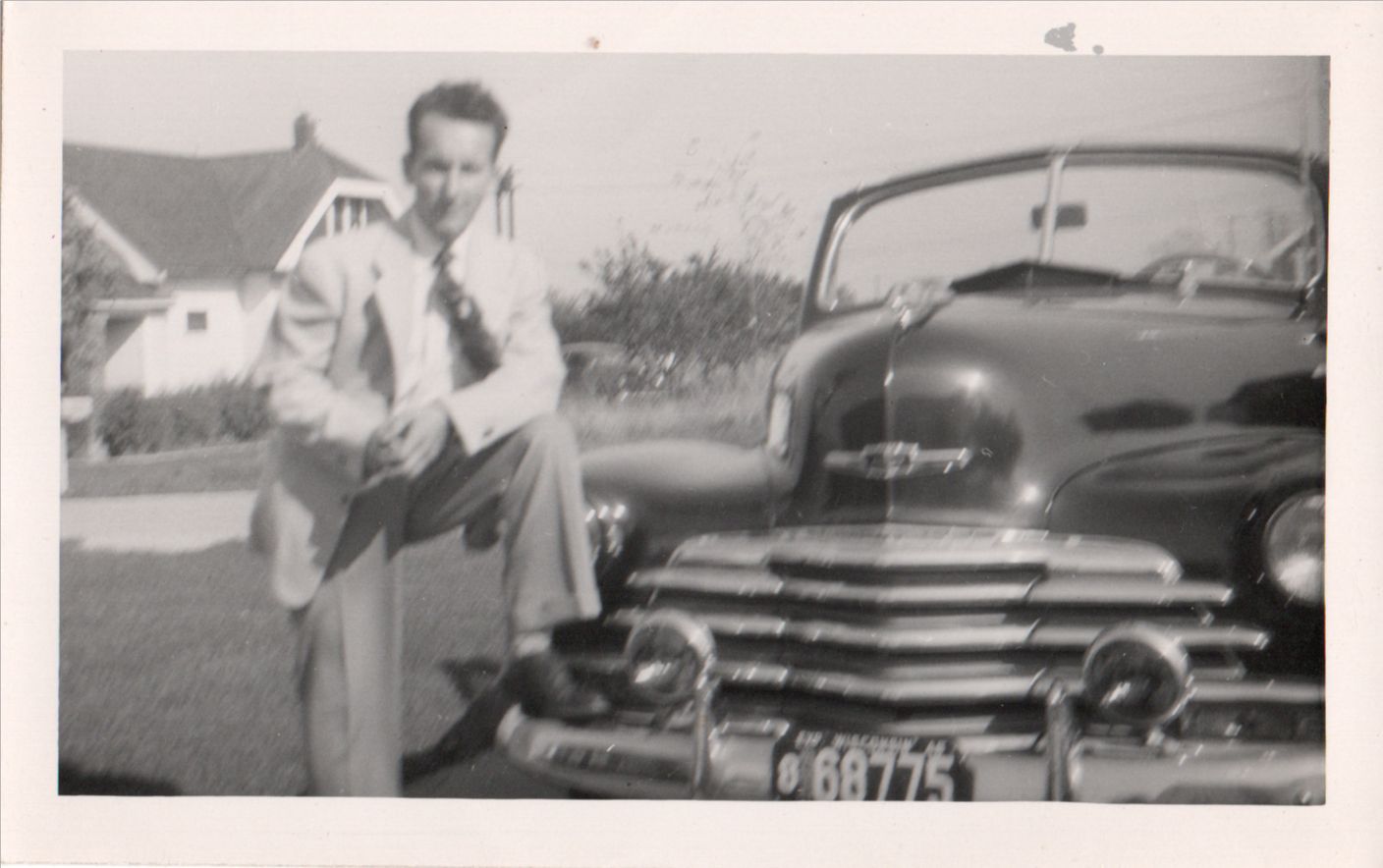 My dad, 1949, proud of his '48 Chevy convertible | Scrolller