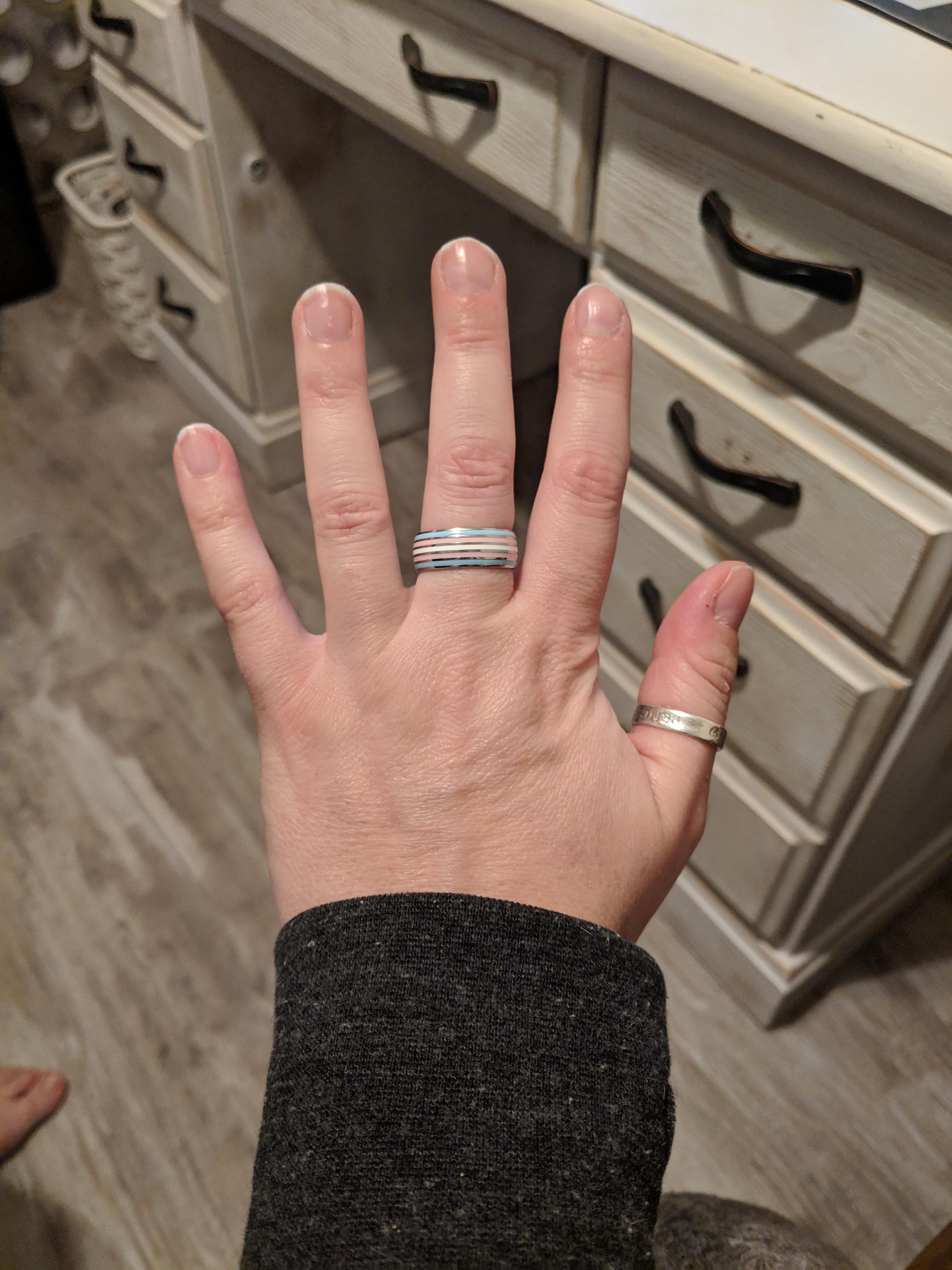 My friend showing off her new Trans pride ring that she got from Etsy. Low key, but always there ...