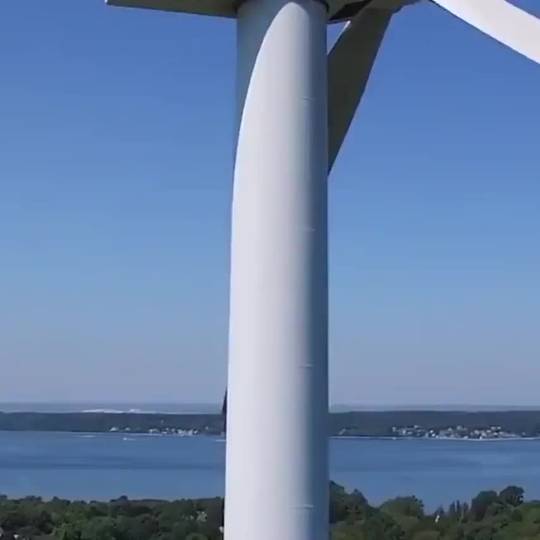 Portsmouth Abbey monk sunbathing on top of wind turbine. | Scrolller