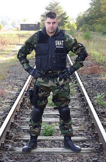 Posing in SWAT gear | Scrolller