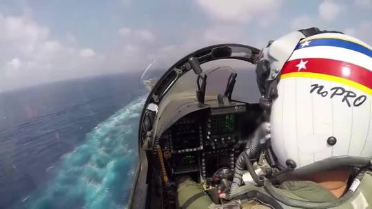 POV of a fighter jet landing on an aircraft carrier | Scrolller