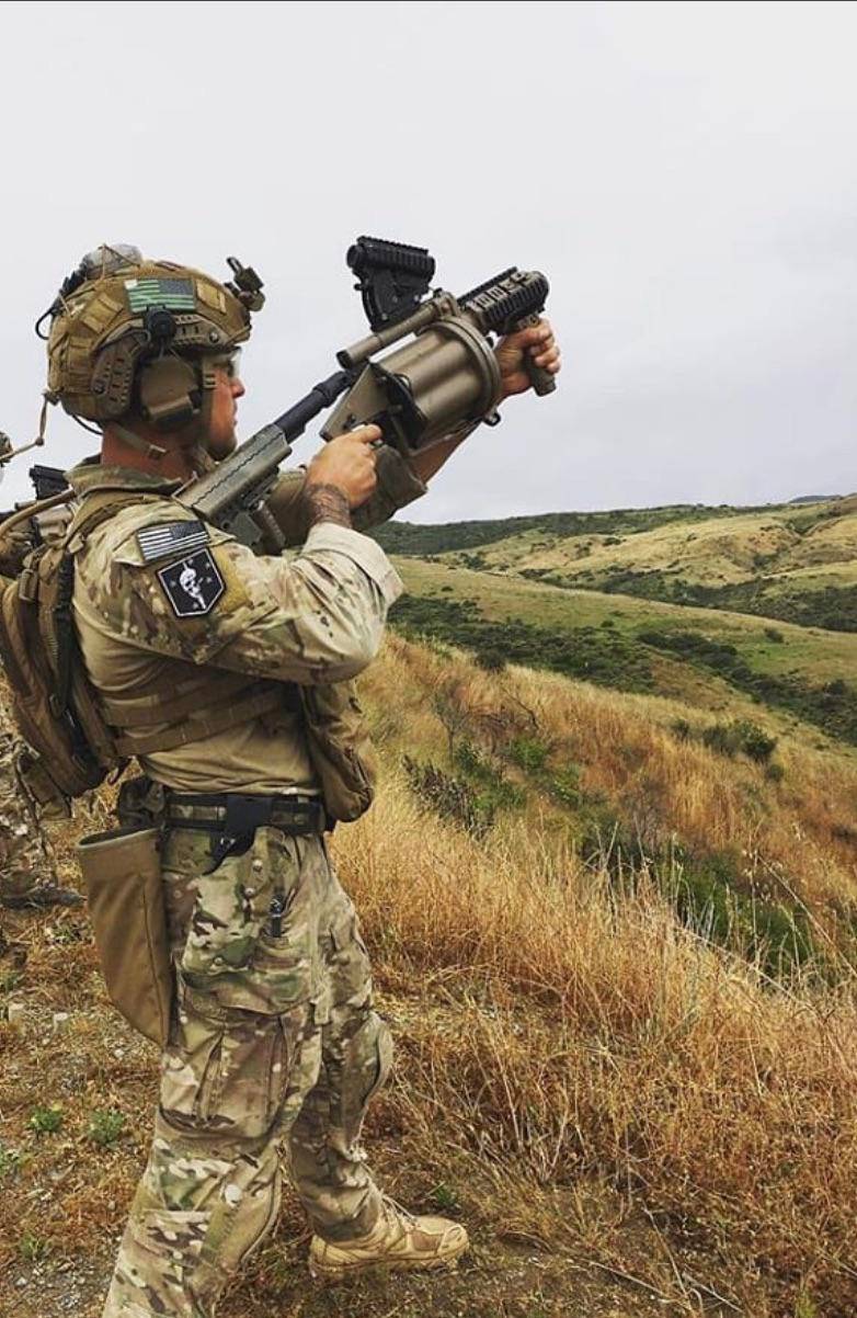 Raider firing a grenade launcher. | Scrolller