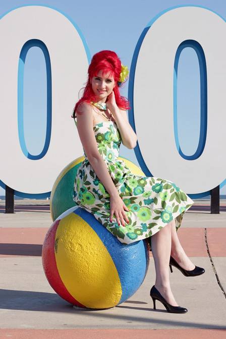 Red Hair, sitting on a beach ball | Scrolller