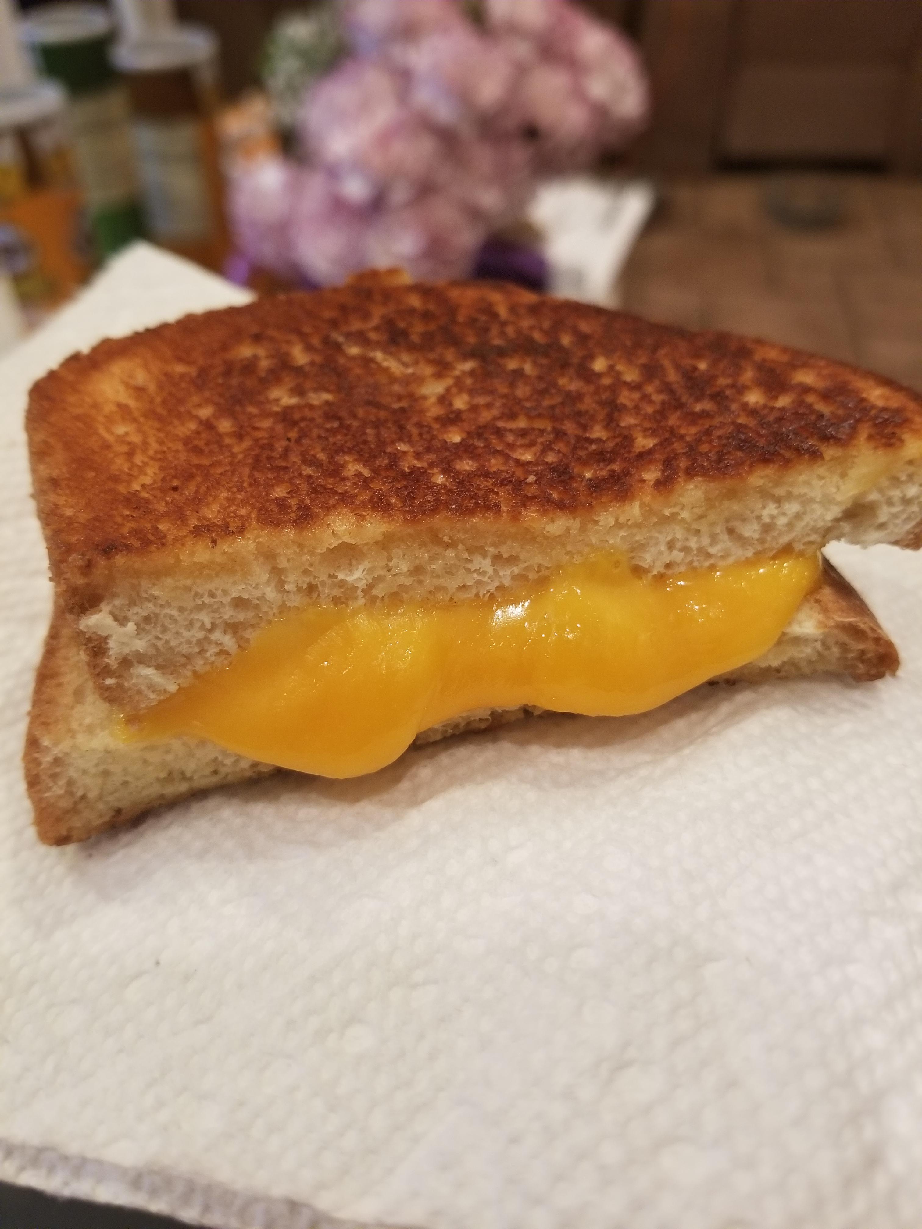 Simple white bread with cheddar cheese. | Scrolller