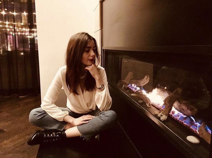 Sitting by the fireplace having a chat | Scrolller