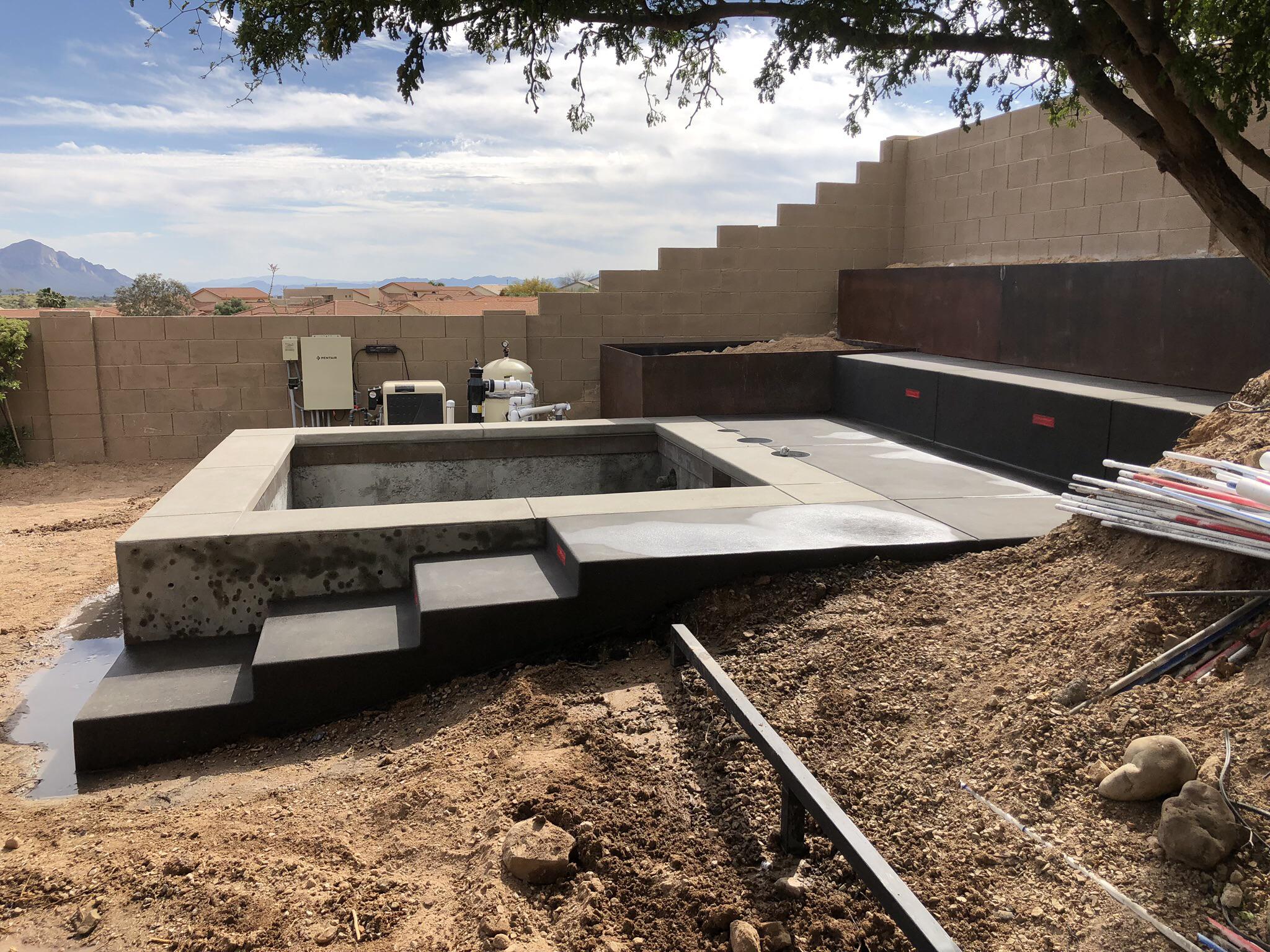 Spa deck, steps, and a seat wall. Landscaping is next. | Scrolller