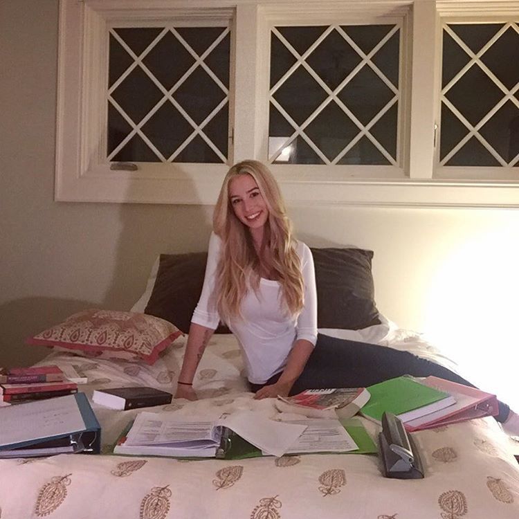 Studying on the bed | Scrolller