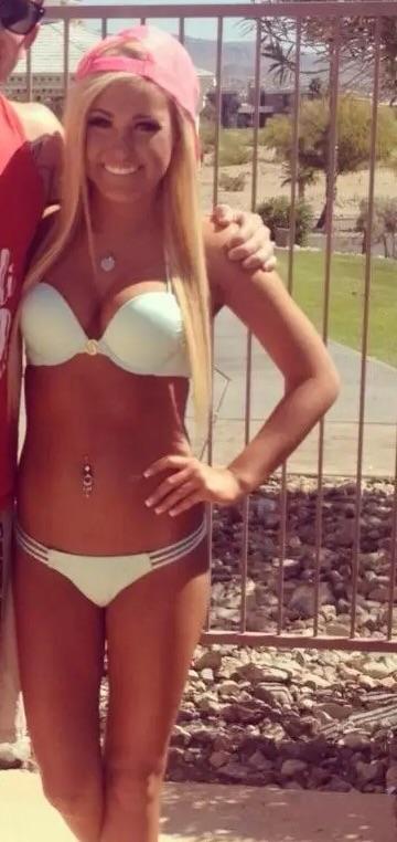 Tan blonde girl wearing bombshell bikini | Scrolller