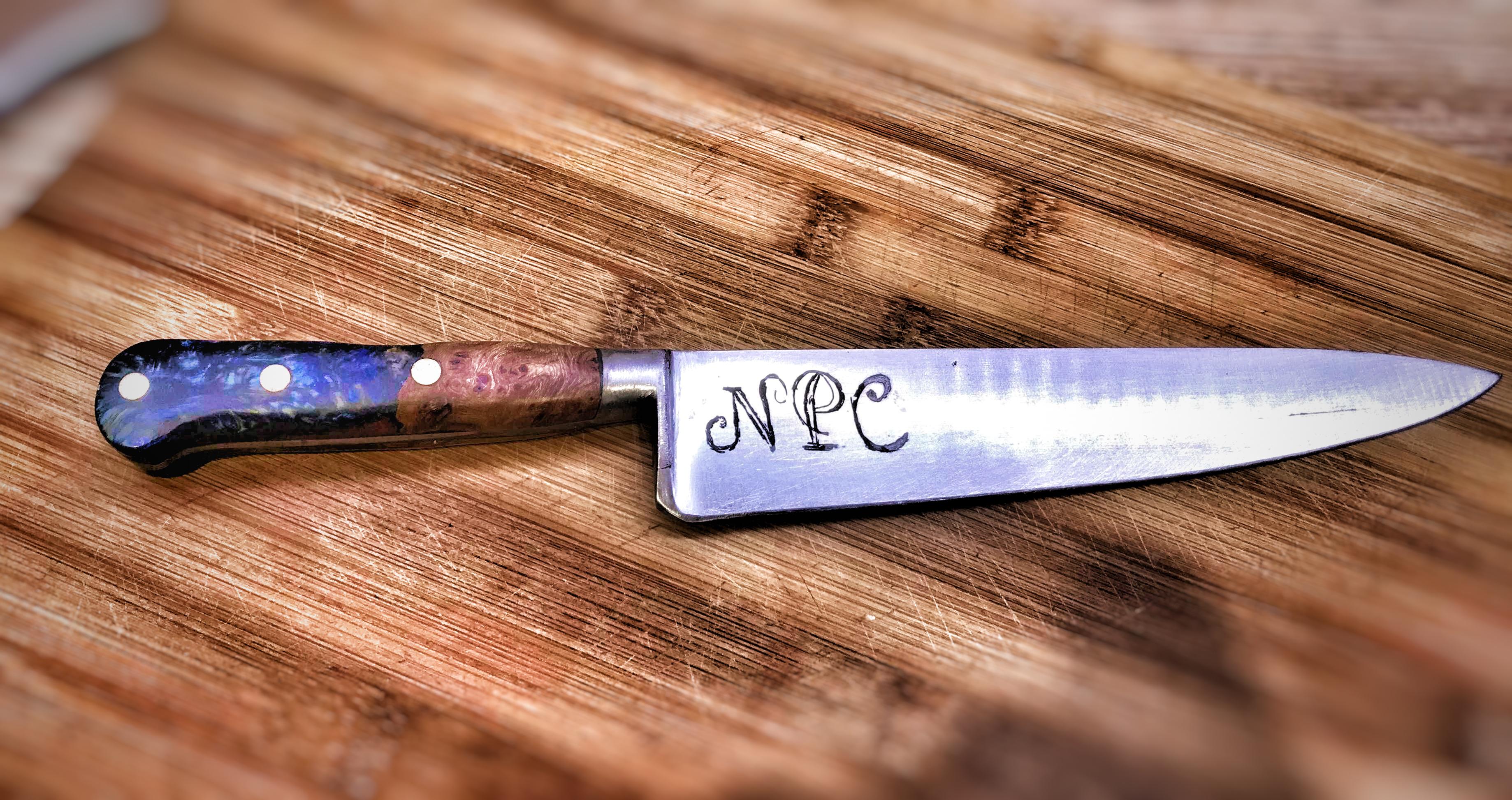 The first knife I've made and I made it for my dad. It's a wood resin handle. I know it's not ...