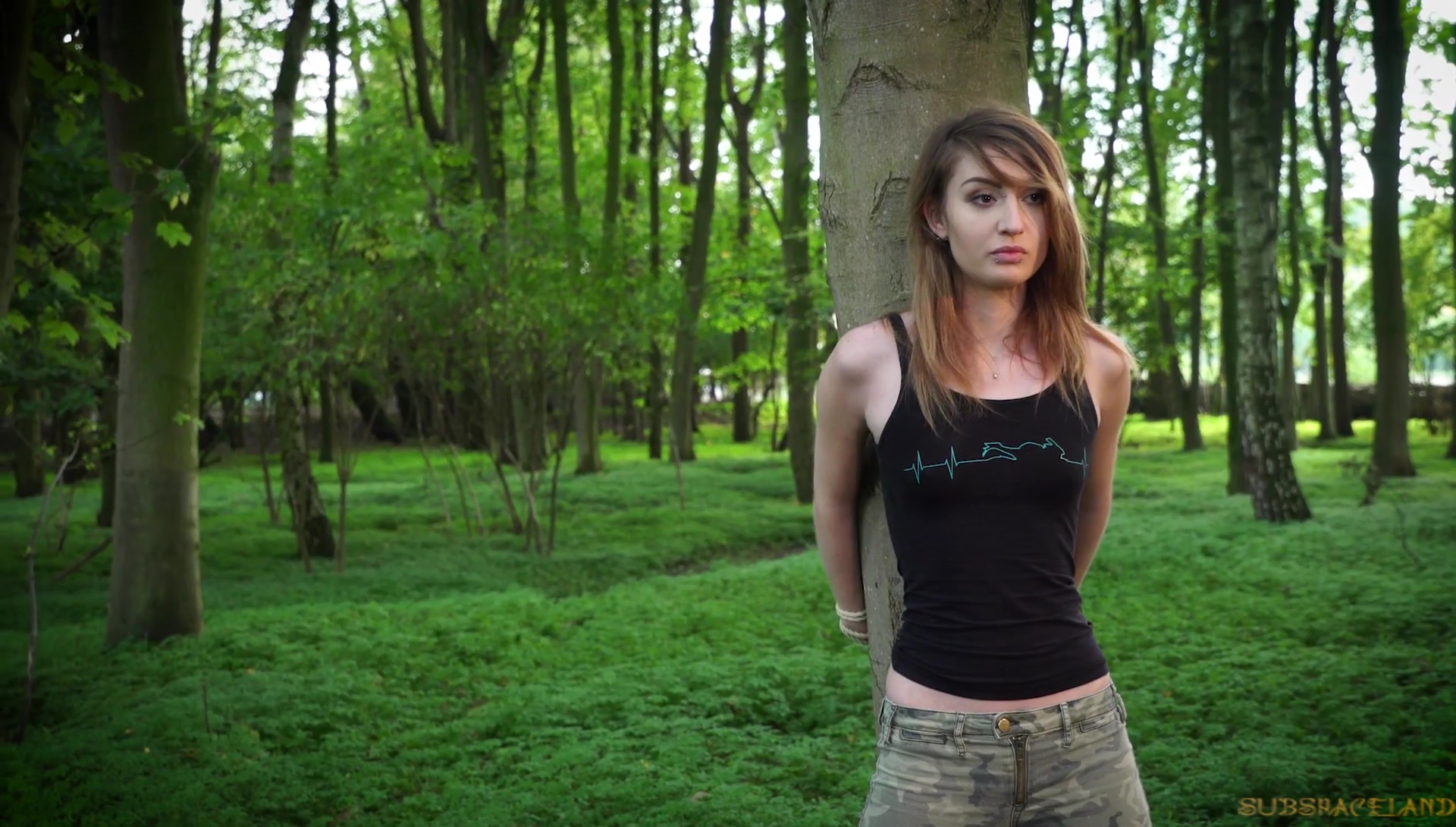 Tied by the tree | Scrolller