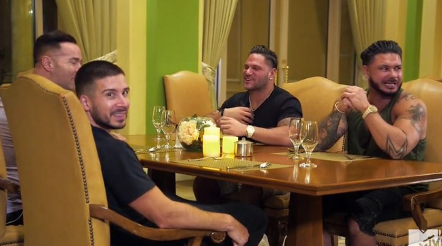 Vinny looks like a little boy at the men's table. | Scrolller