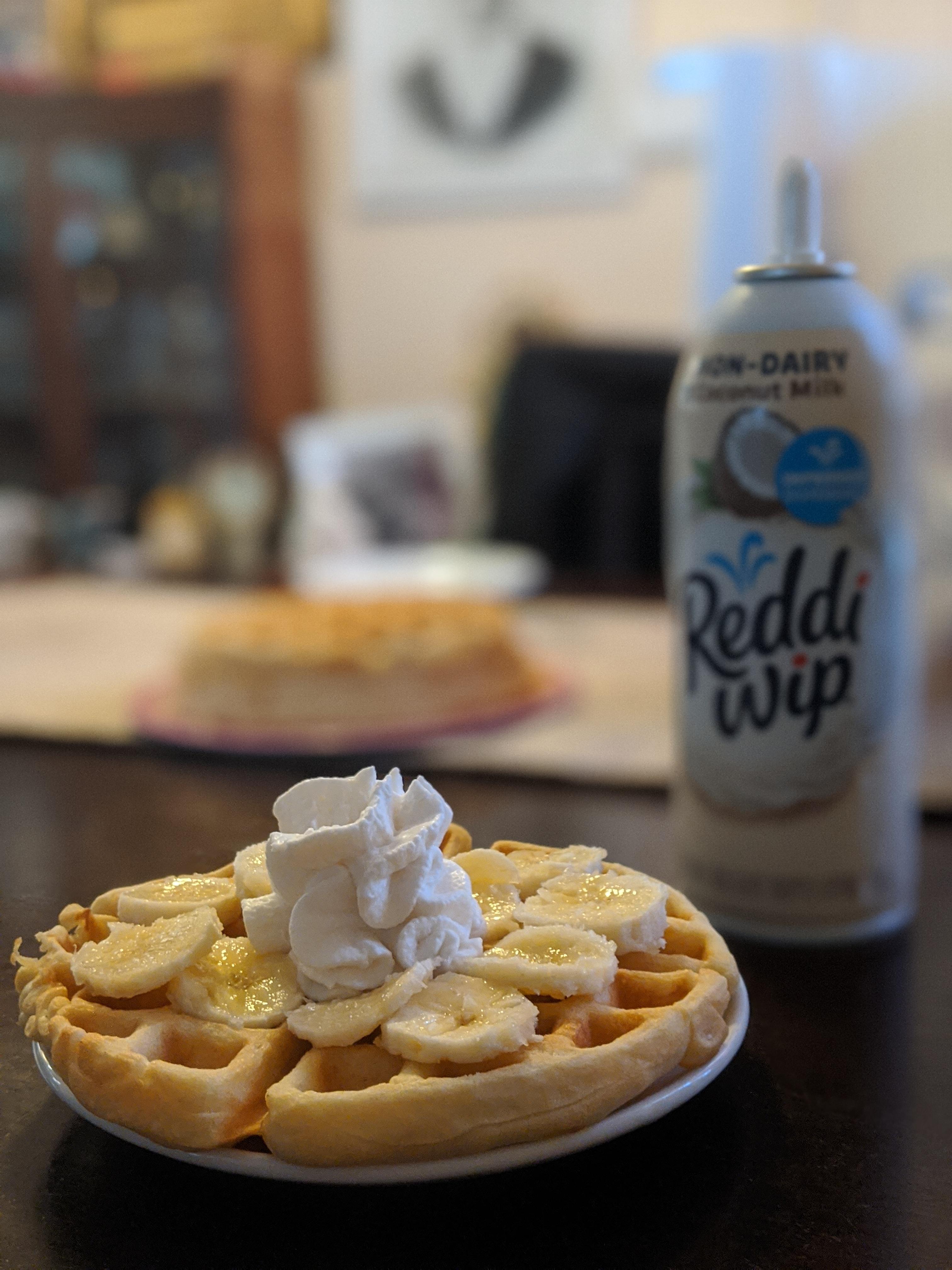 Waffles, topped with bananas and whipped cream! | Scrolller