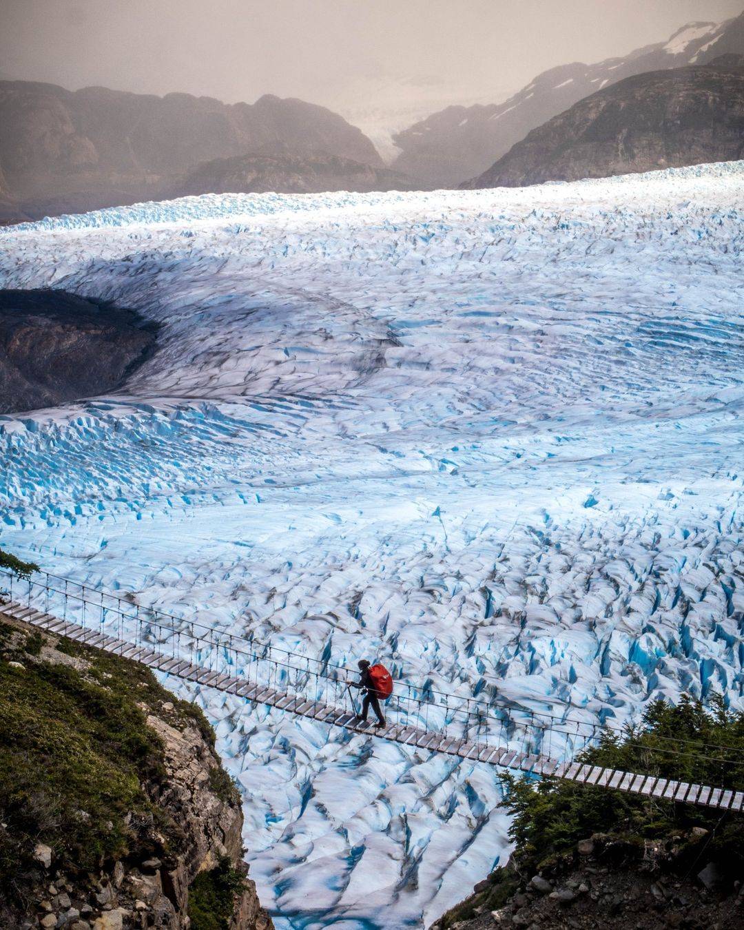 Walking across the hanging bridge above the Grey Glacier, Torres del Paine National Park ...