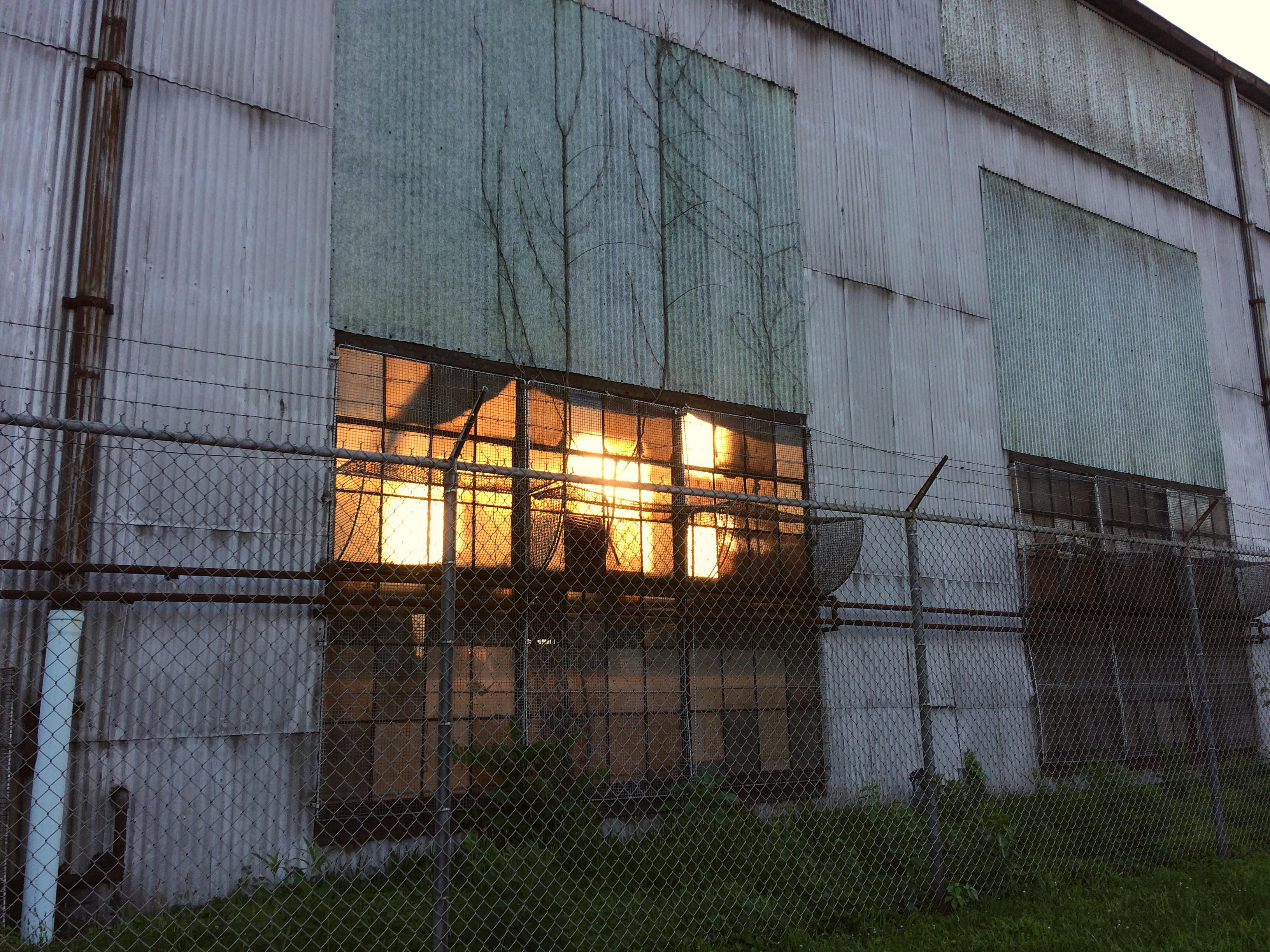 Warehouse with the Light Shining Through | Scrolller
