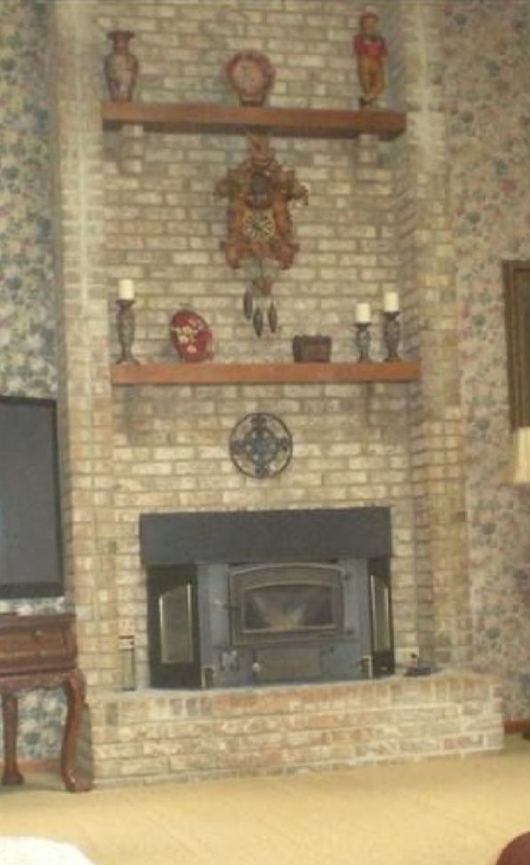 where to hang a mirror on this 2 story fireplace with 2 Mantle's? | Scrolller