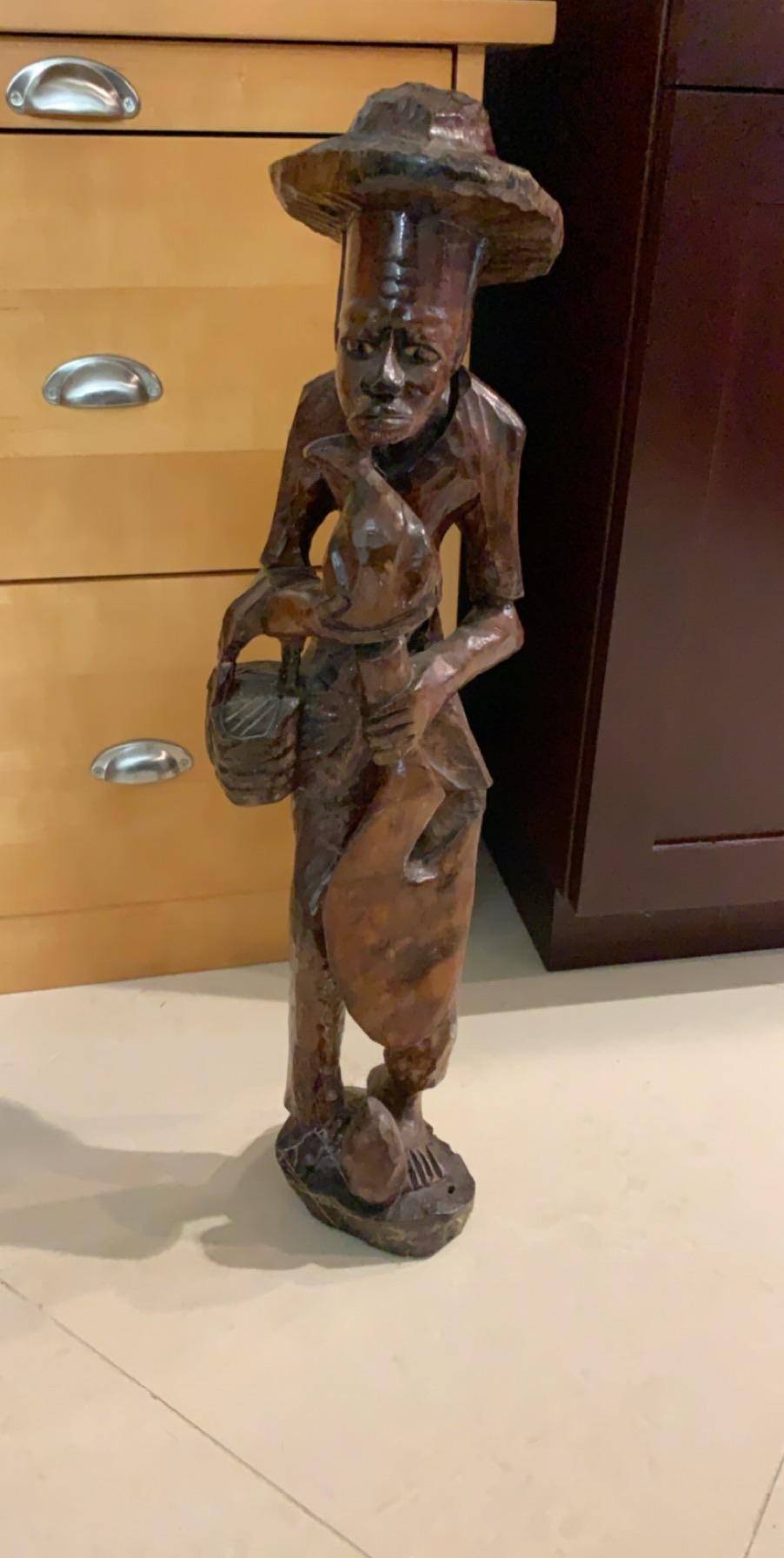 Wood statue. Looks to be hand carved and is a little over 2ft tall | Scrolller