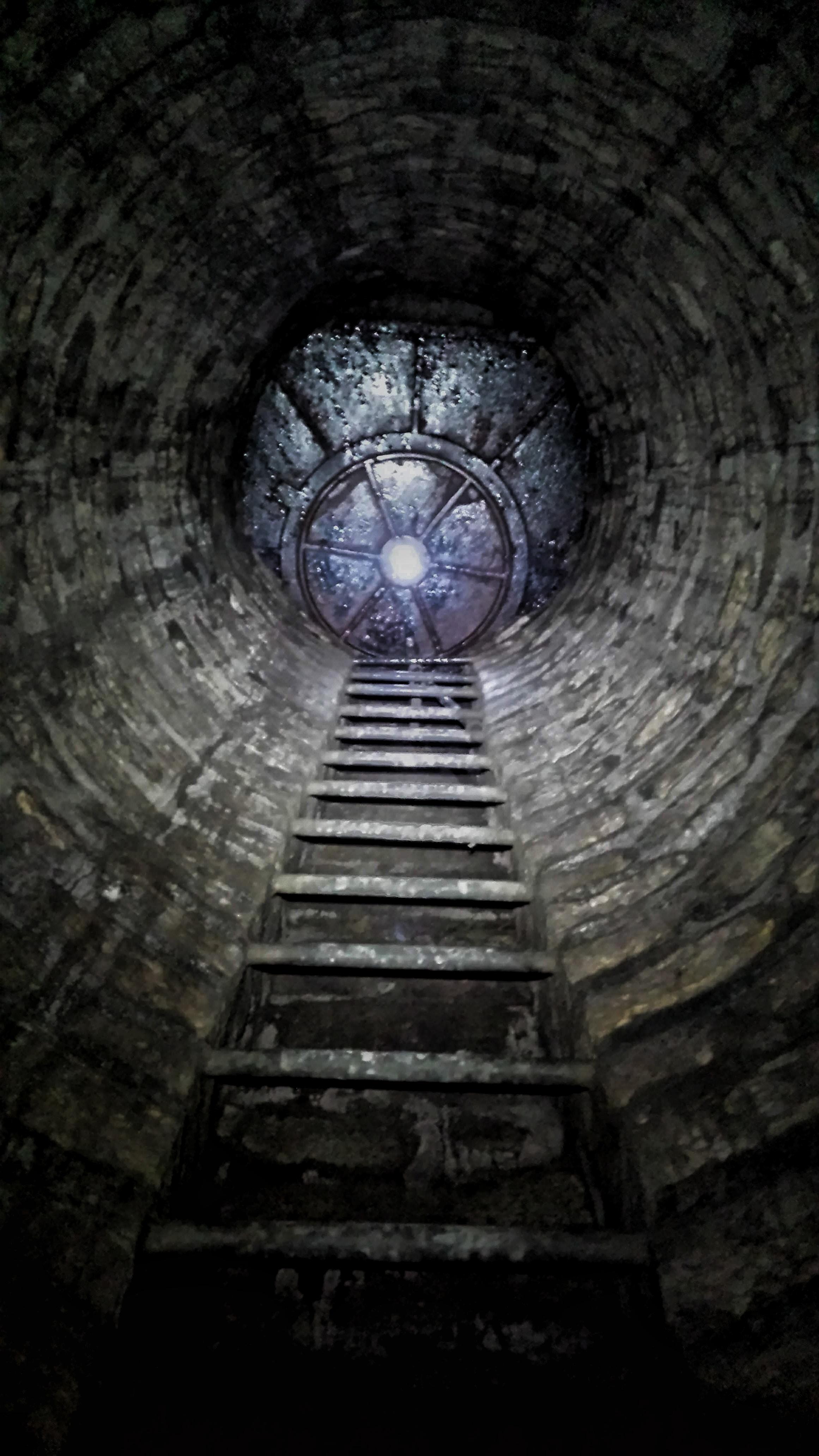 A catacomb manhole view from under, a famous "plaque soleil" the cataphile symbol | Scrolller