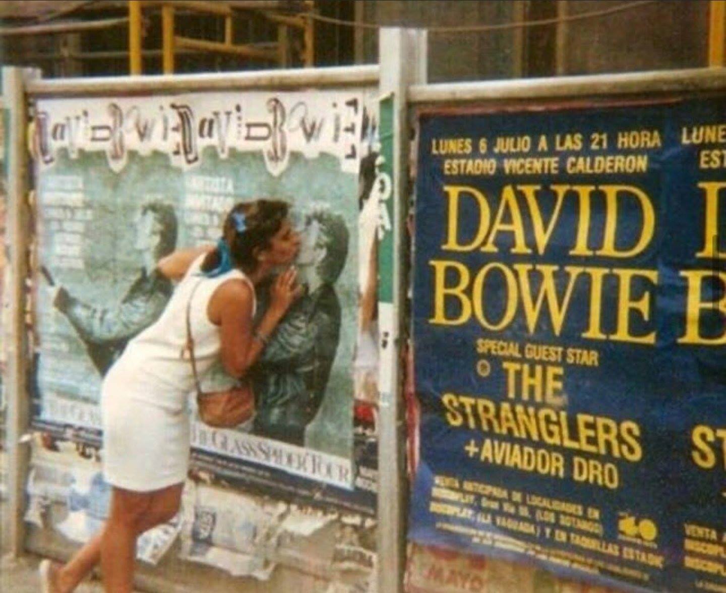 A girl kissing the posters of David Bowie in Madrid, 1987. | Scrolller