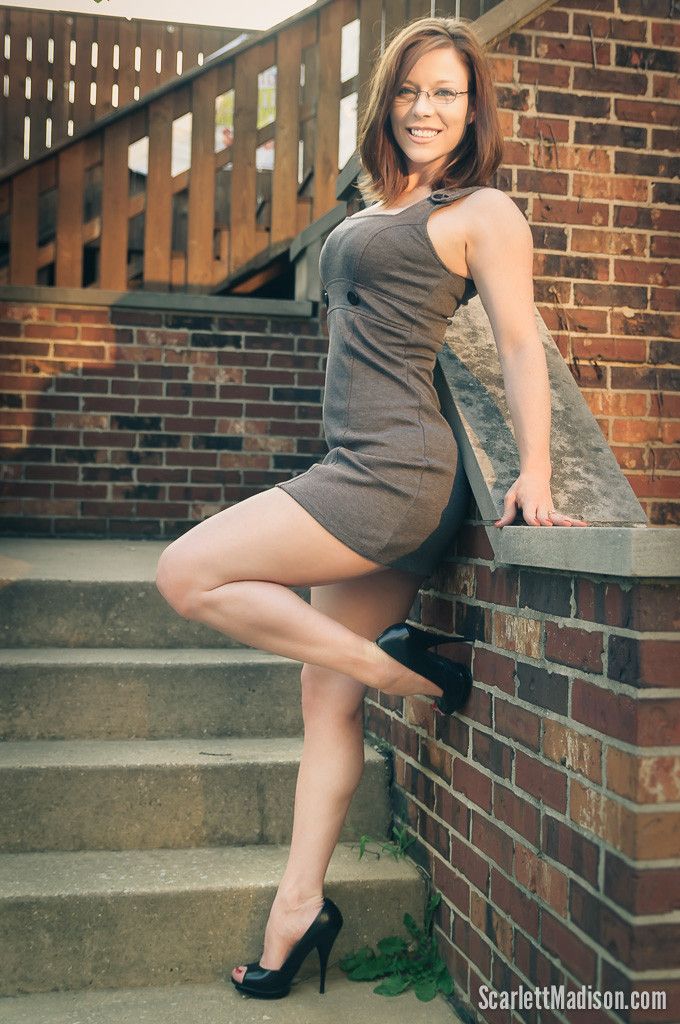 A modern pin-up girl striking a pose "Downtown" | Scrolller