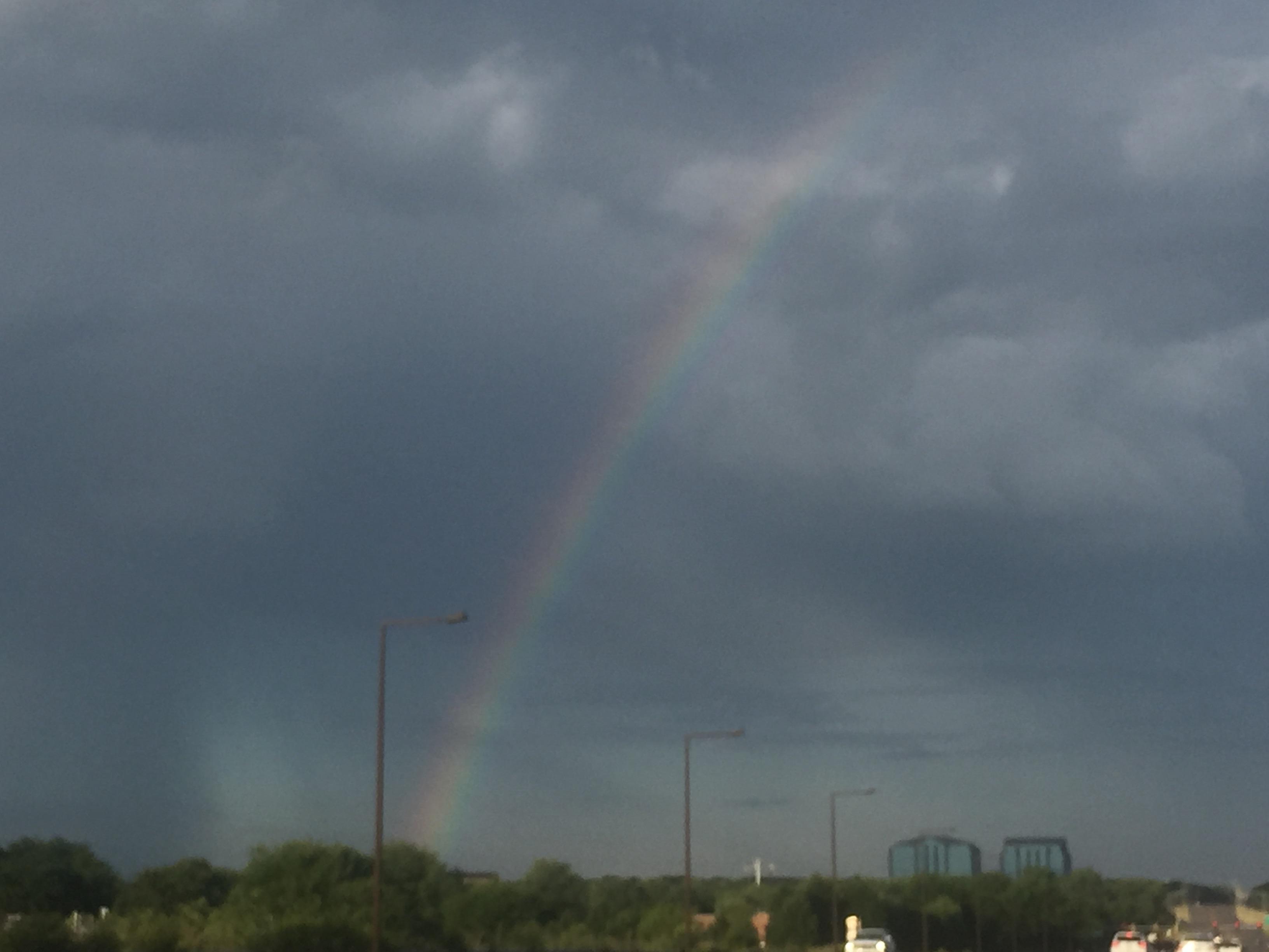 A rainbow during a thunderstorm. | Scrolller