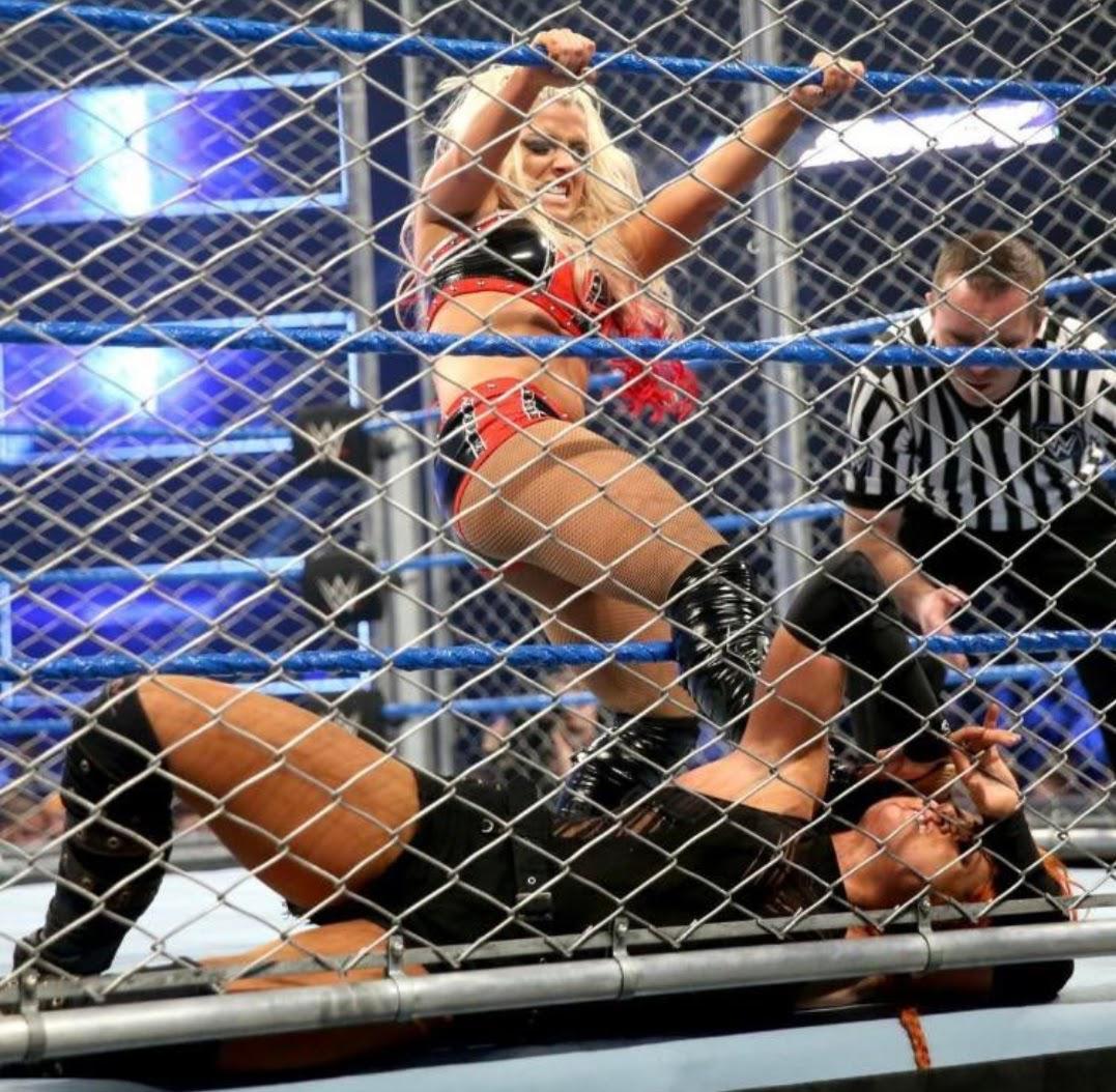 Alexa bliss shoving her boot into beckys face. | Scrolller