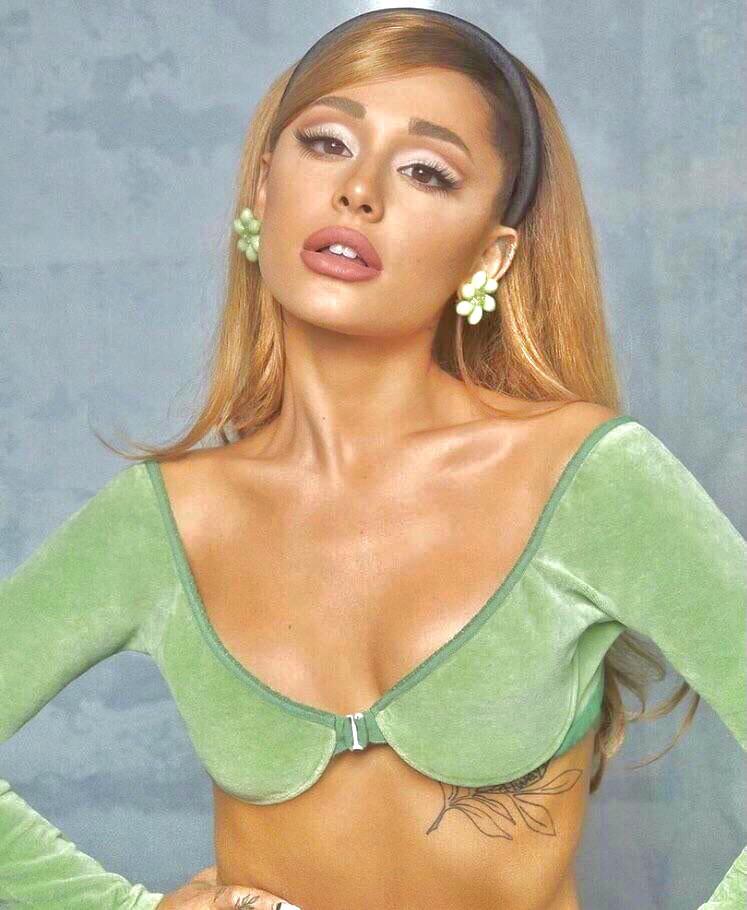Ariana Grande busting out of a perfect green velvet top | Scrolller