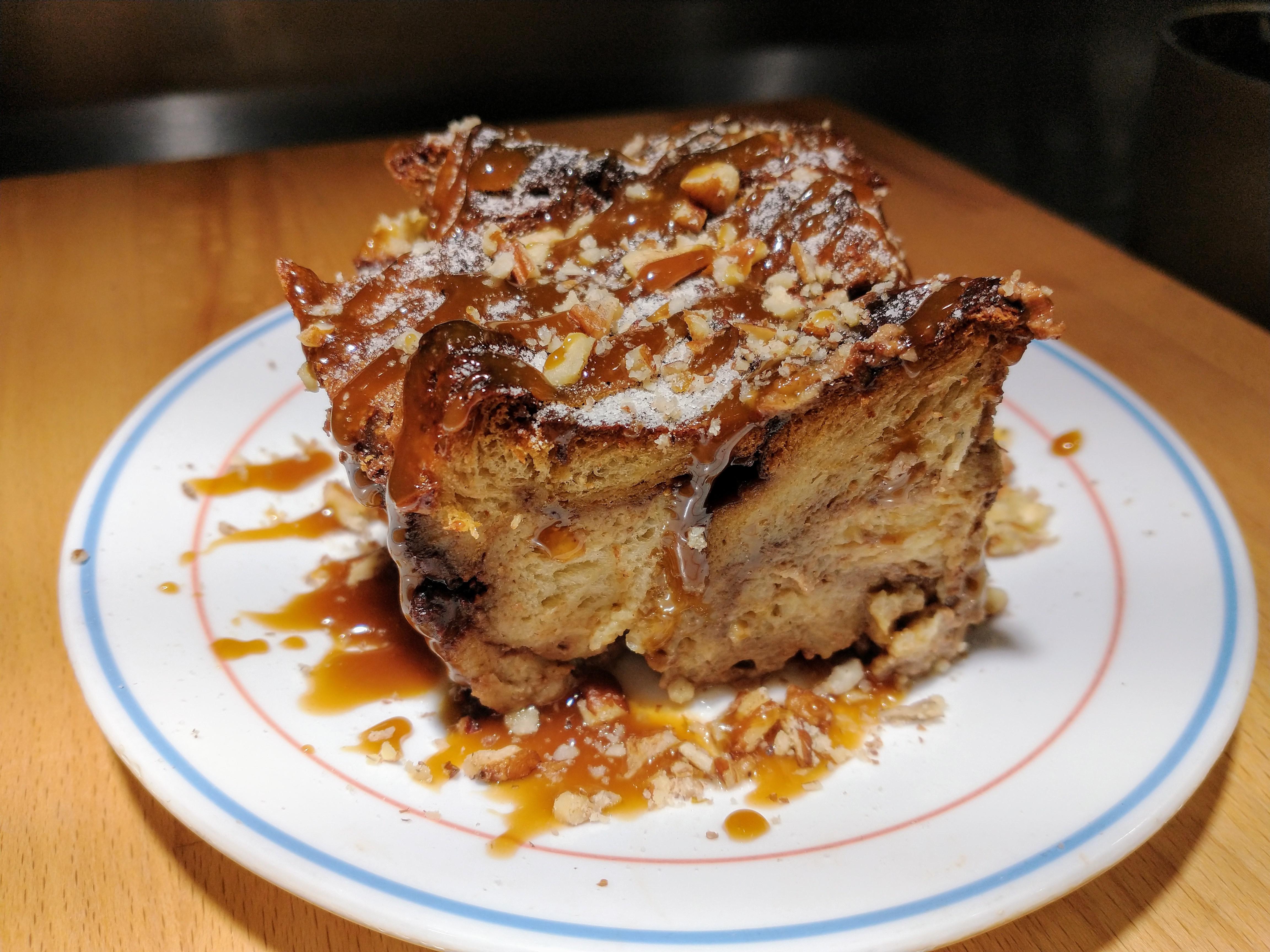 Bénédictine and Brandy Bread Pudding with Chocolate Chips, topped with Powdered Sugar, Caramel ...
