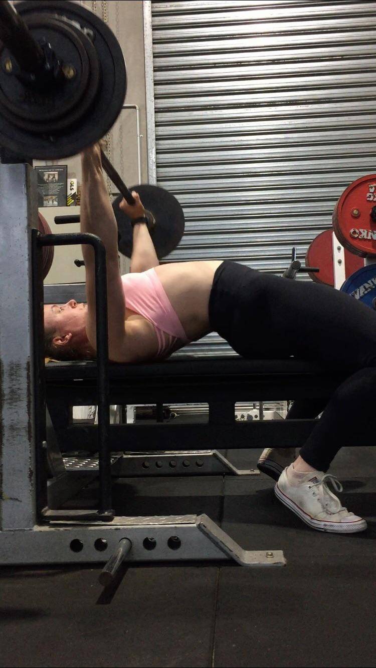 Bench press in pretty pink sports bra | Scrolller