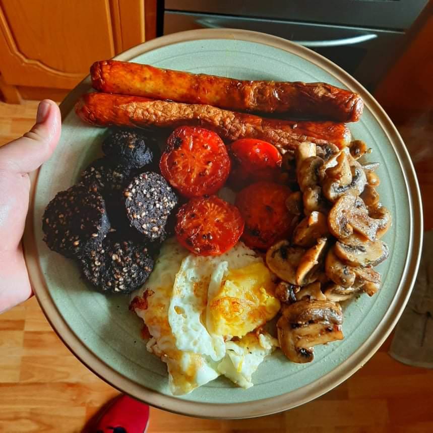 Black pudding, sausages, mushrooms, sundried tomatoes with egg for breakfast | Scrolller