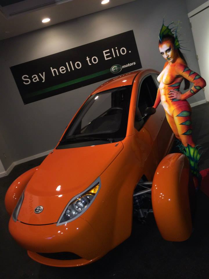 Body painted model and a Elio | Scrolller